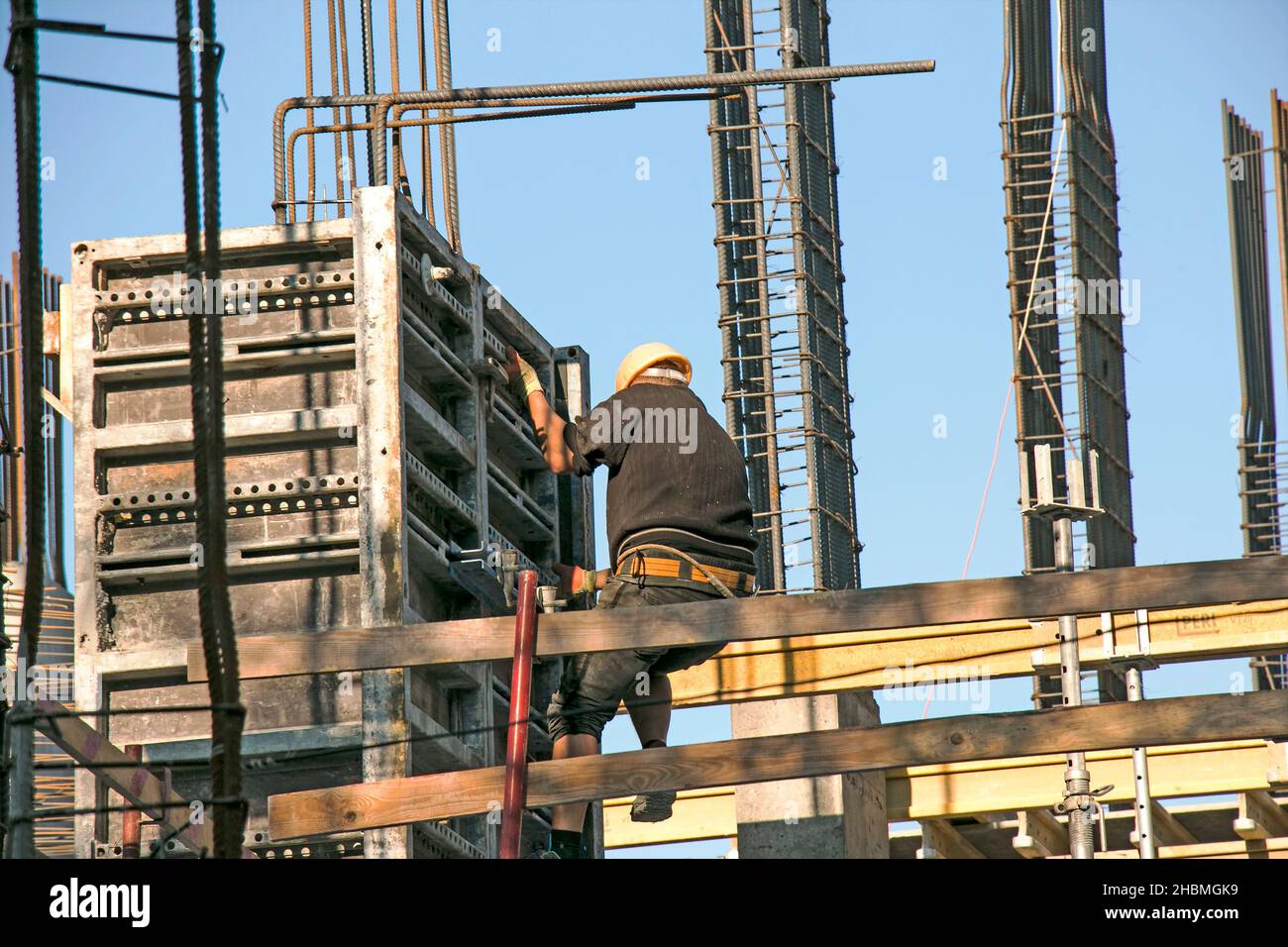 Construction of a high-rise building. Workers prepare formwork for ...