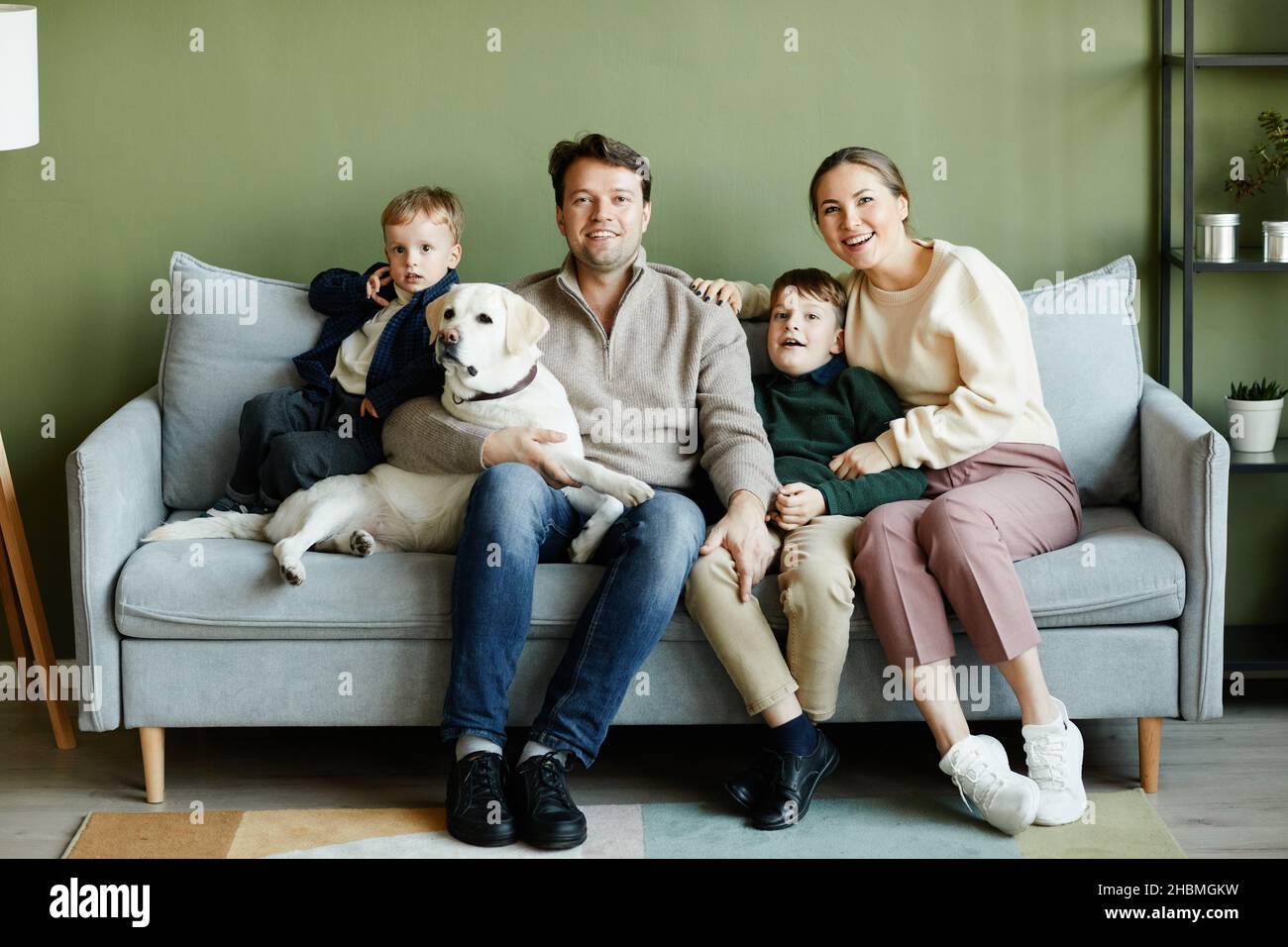 Family with two kids and dog hi-res stock photography and images - Alamy