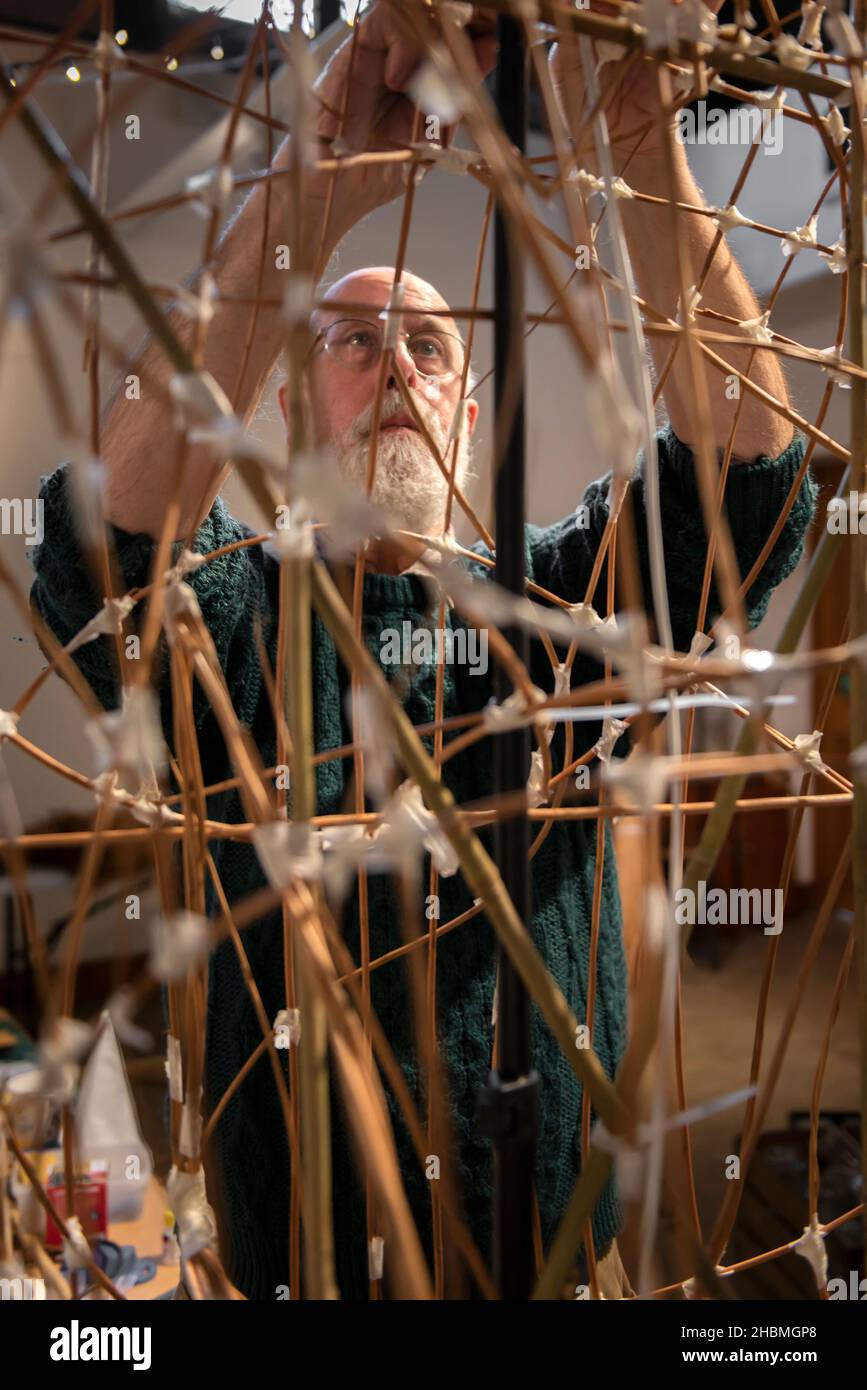 Sculptor Anthony Crosby creating a large paper and withy sculpture to ...