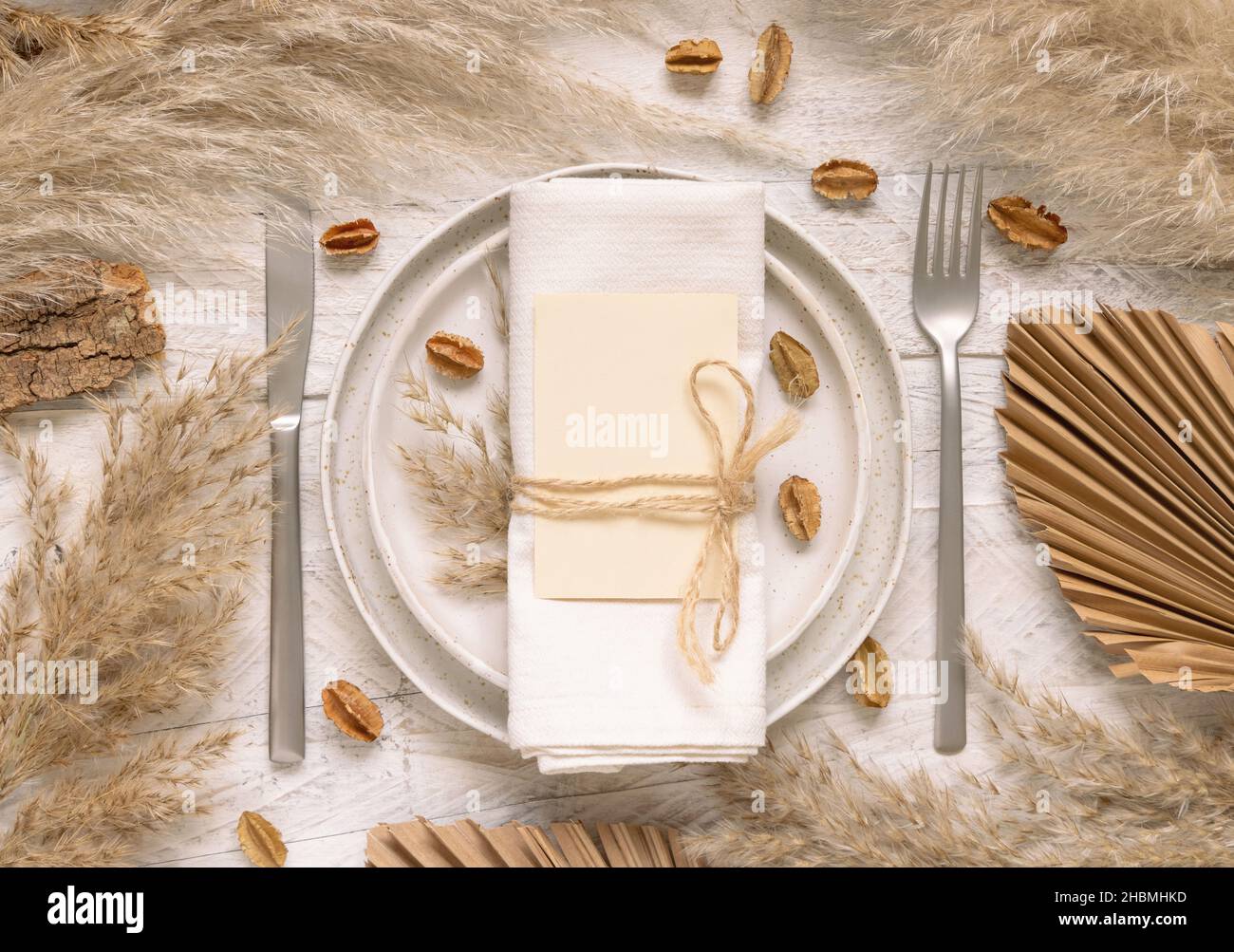 Wedding table place with horizontal blank card on white wooden table ...