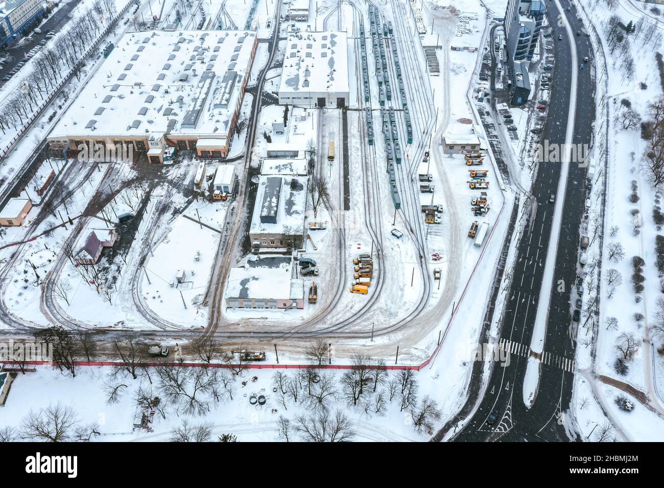 tram depot in winter foggy day. urban industrial district with snow ...