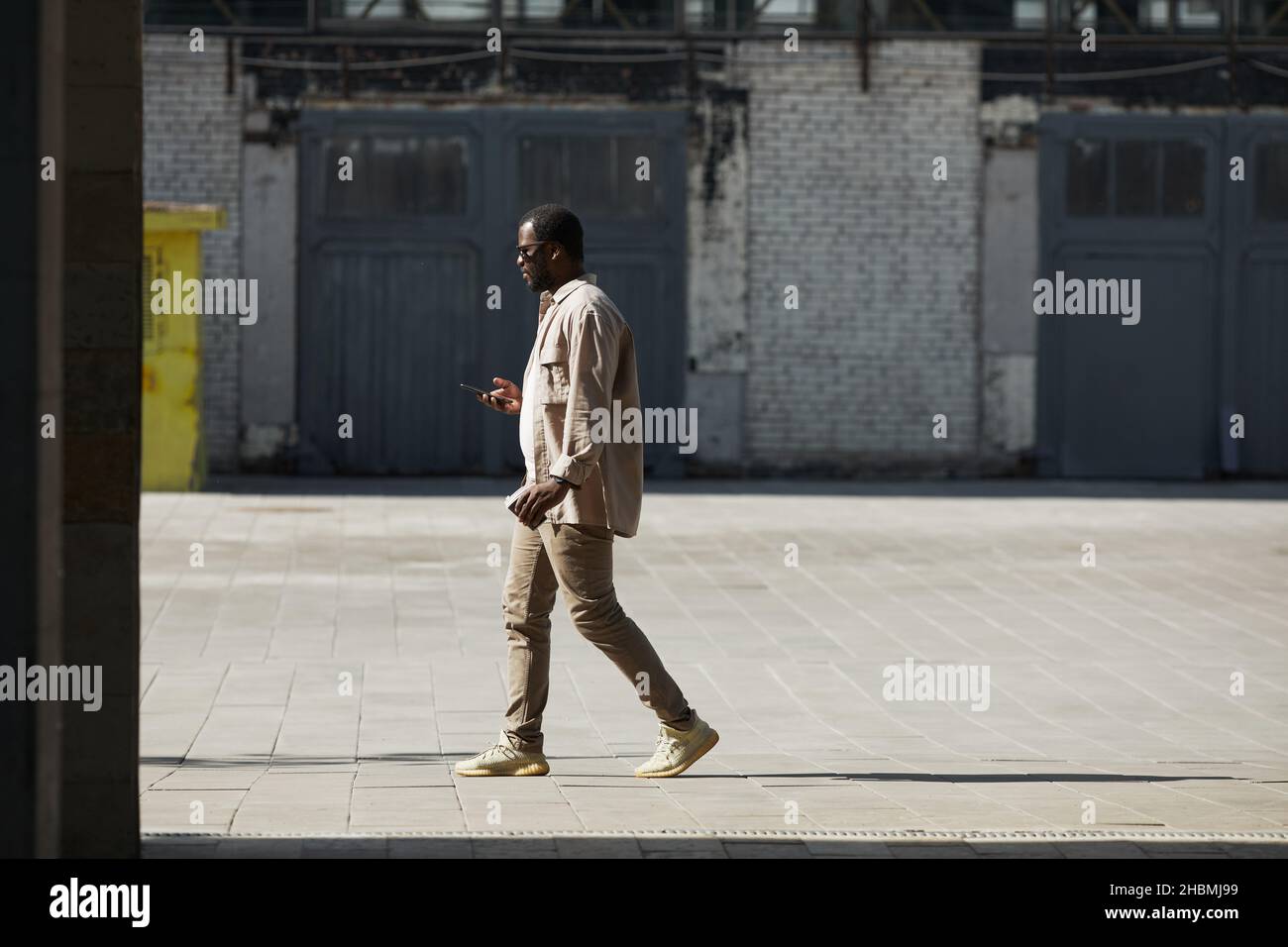 African american man walking hi-res stock photography and images - Alamy