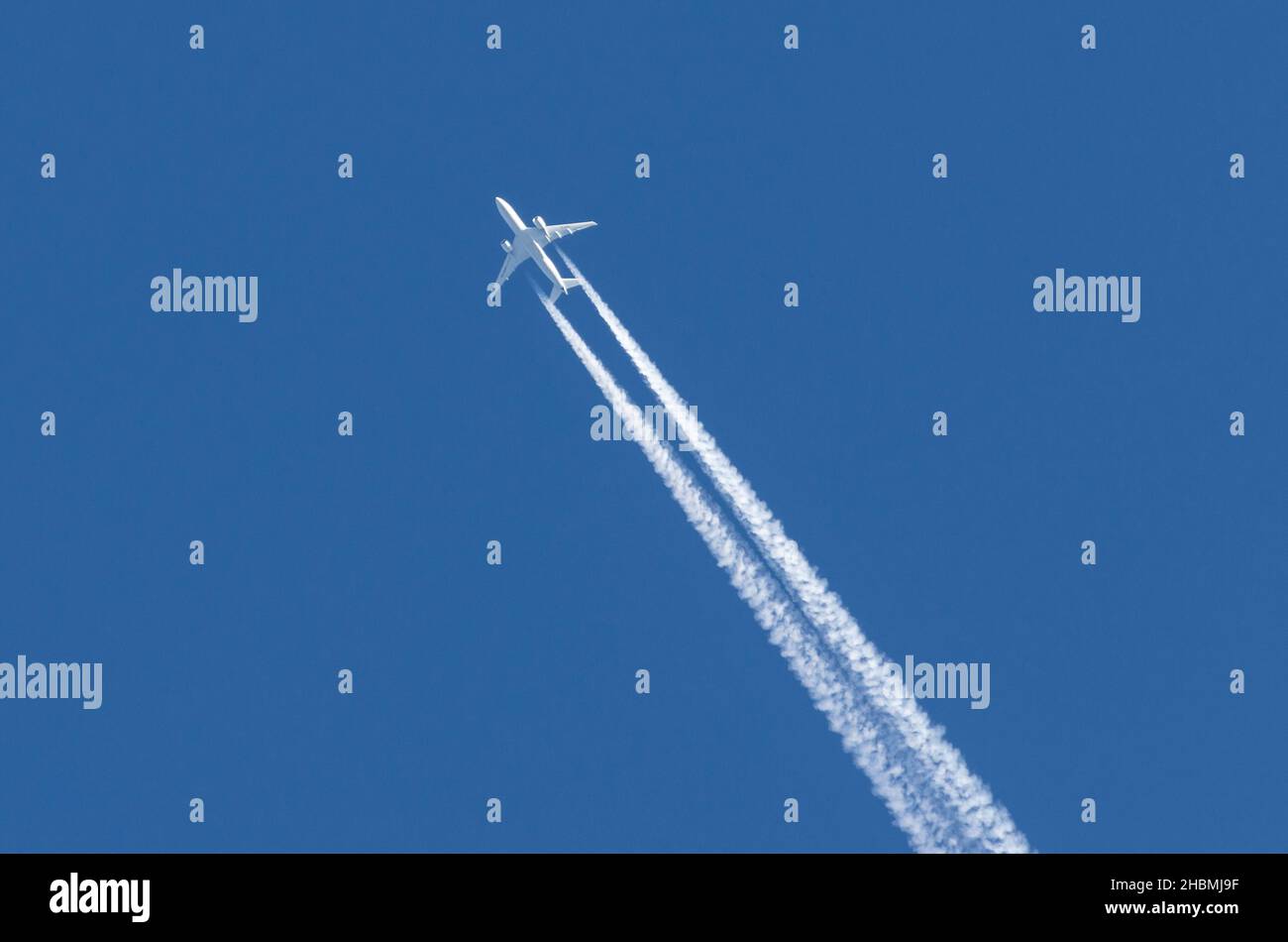 White aircraft big two engines aviation airport contrail clouds Stock ...