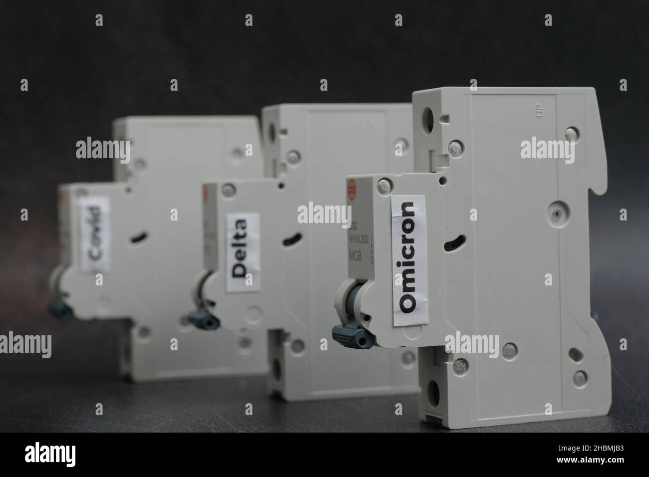 Circuit breaker switches labelled with Omicron Delta and Covid to ...