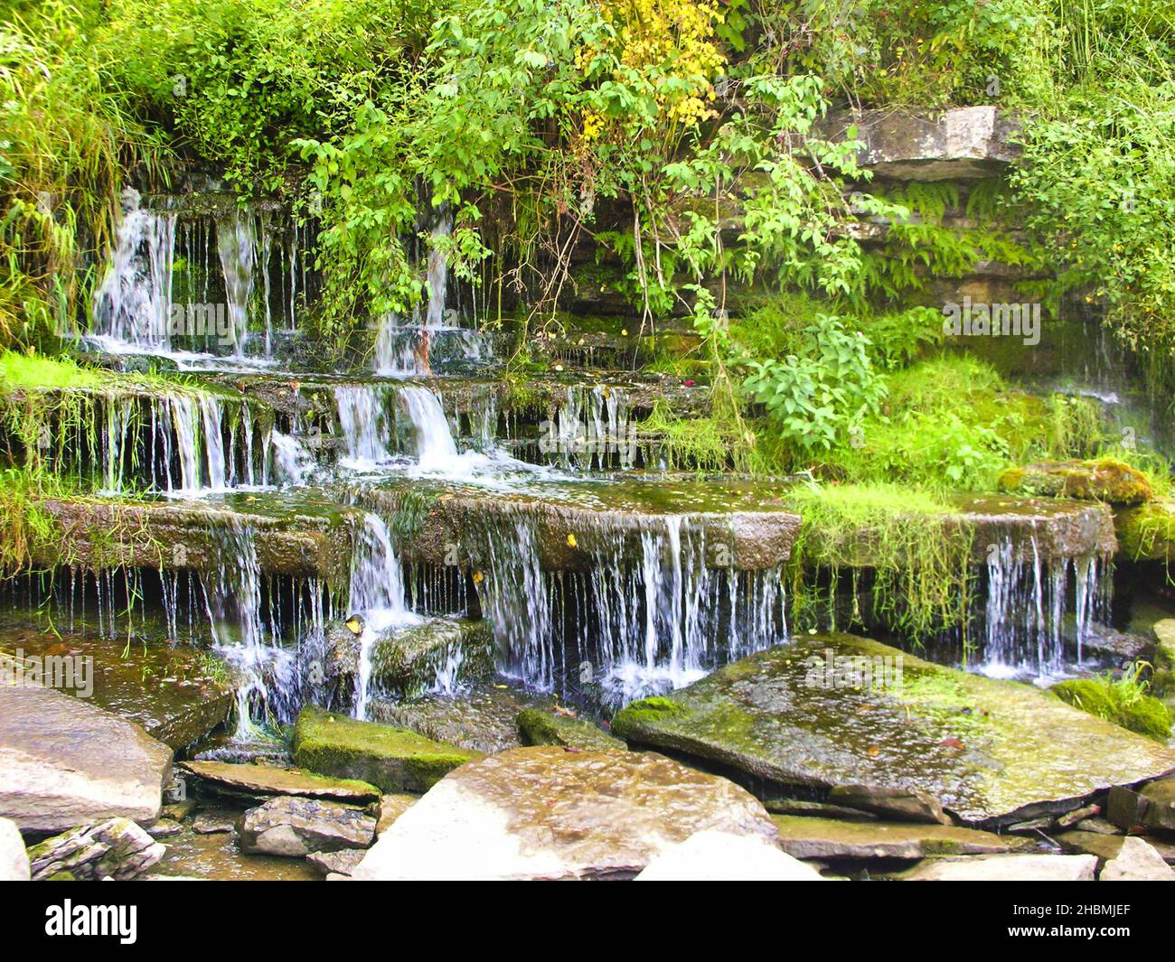 A beautiful scene of a cascade waterfall in the woods Stock Photo - Alamy