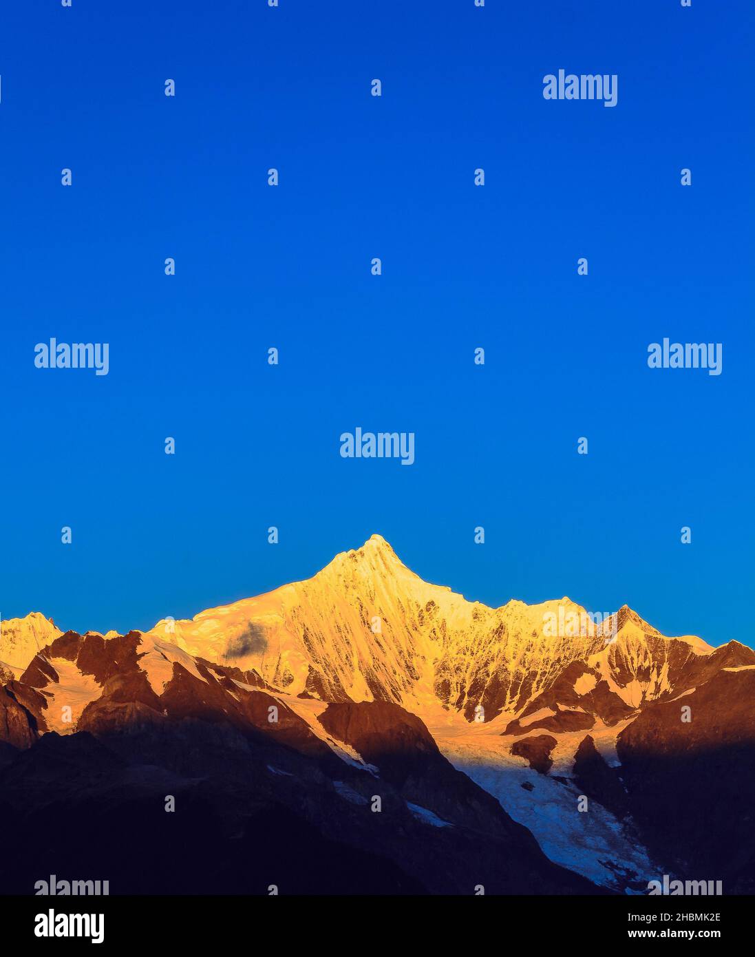 Meri Snow Mountain sunrise golden view China Stock Photo - Alamy