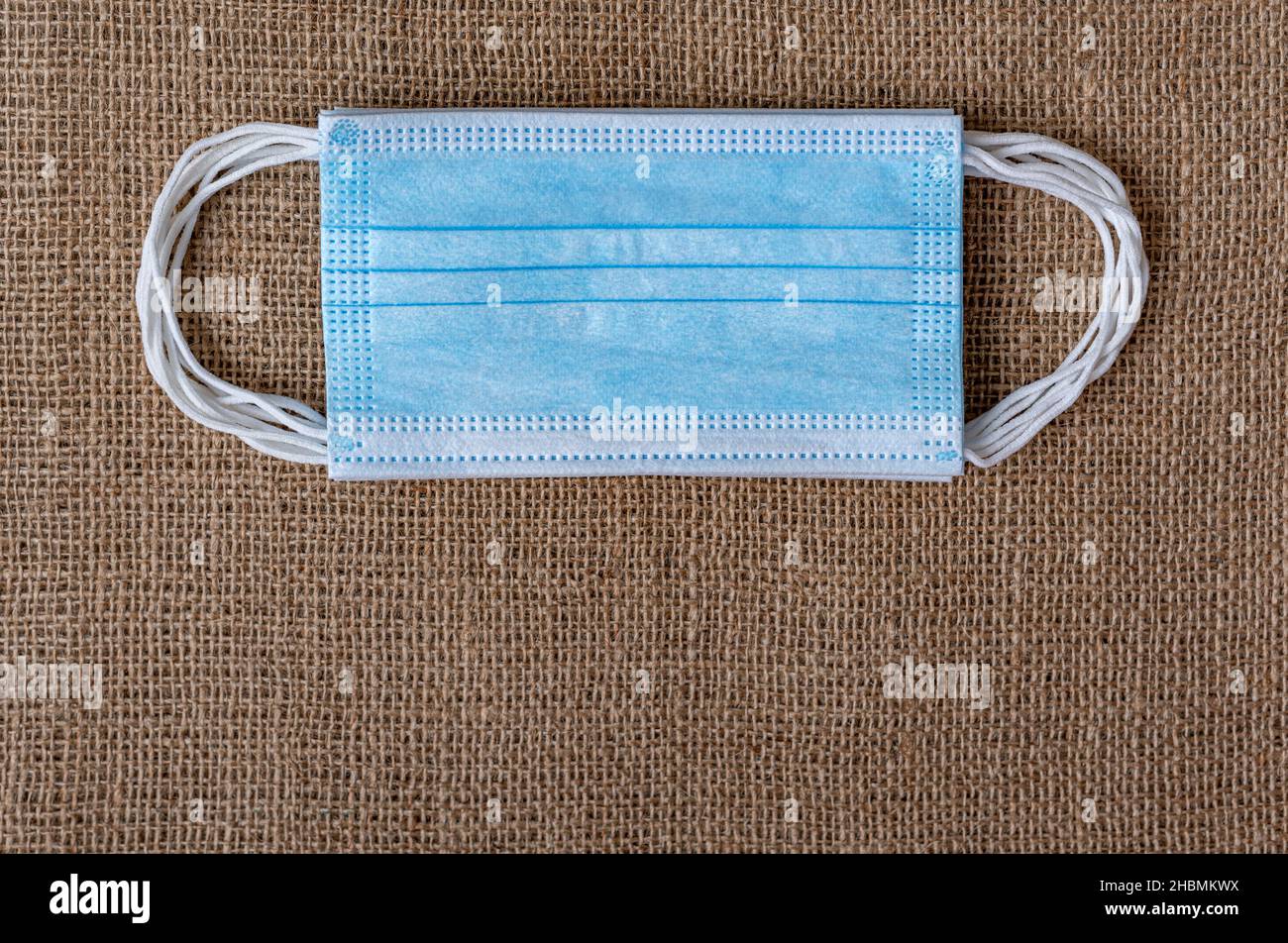 Medical masks on a burlap background Stock Photo - Alamy