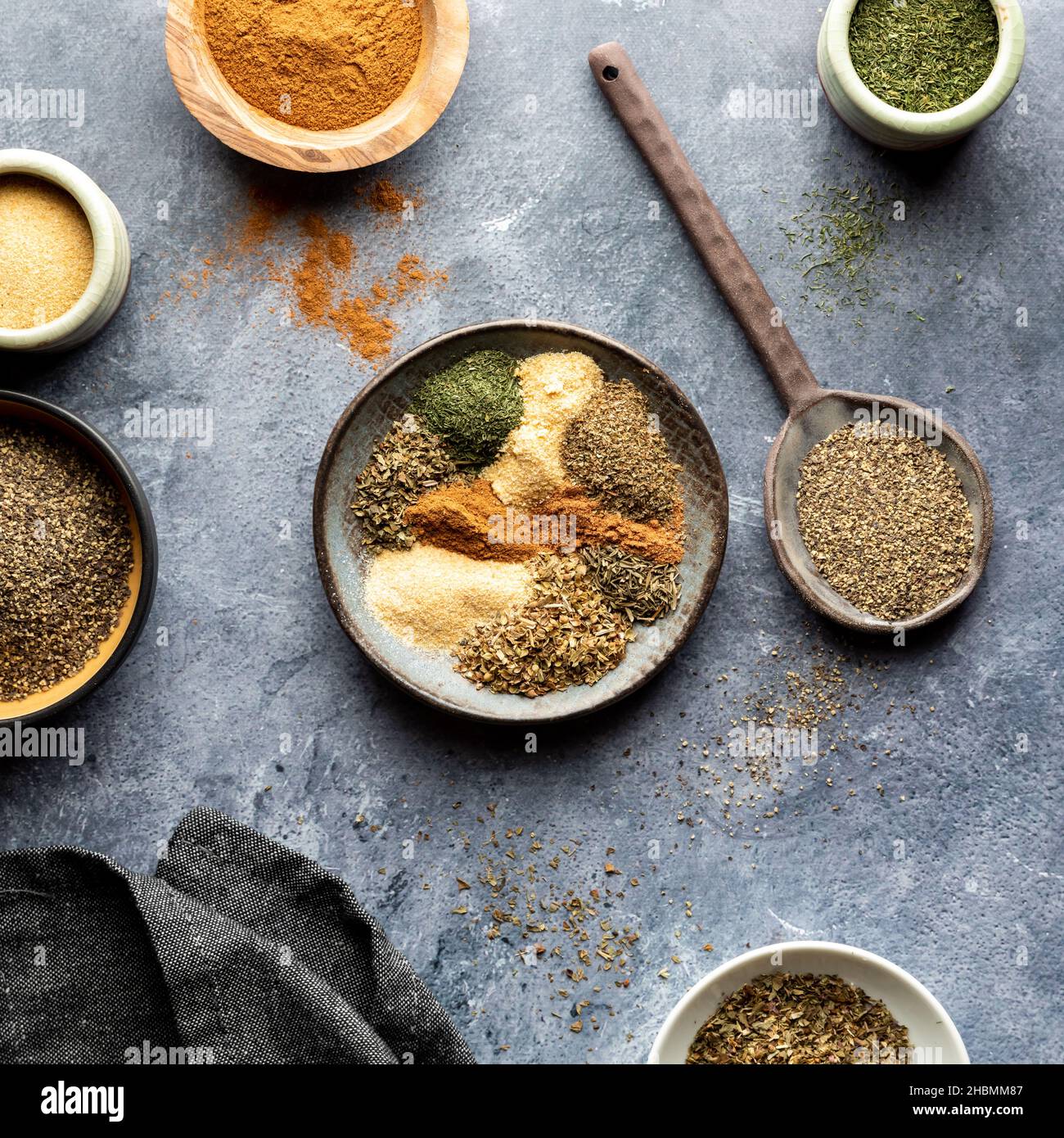 Top down view of an assortment of dry spices used to make a Greek ...