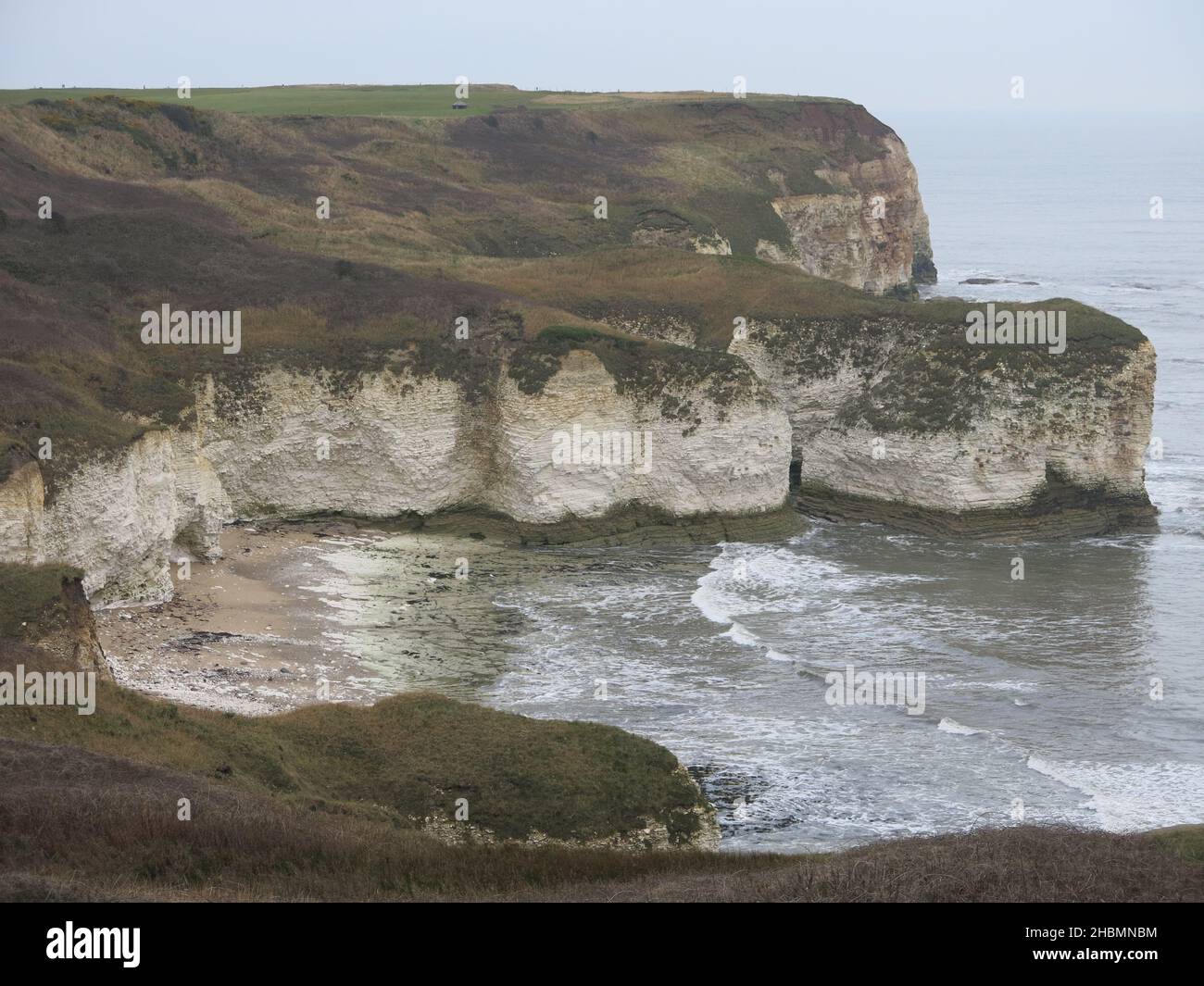 The dramatic white chalk cliffs on the promontory of Flamborough Head ...