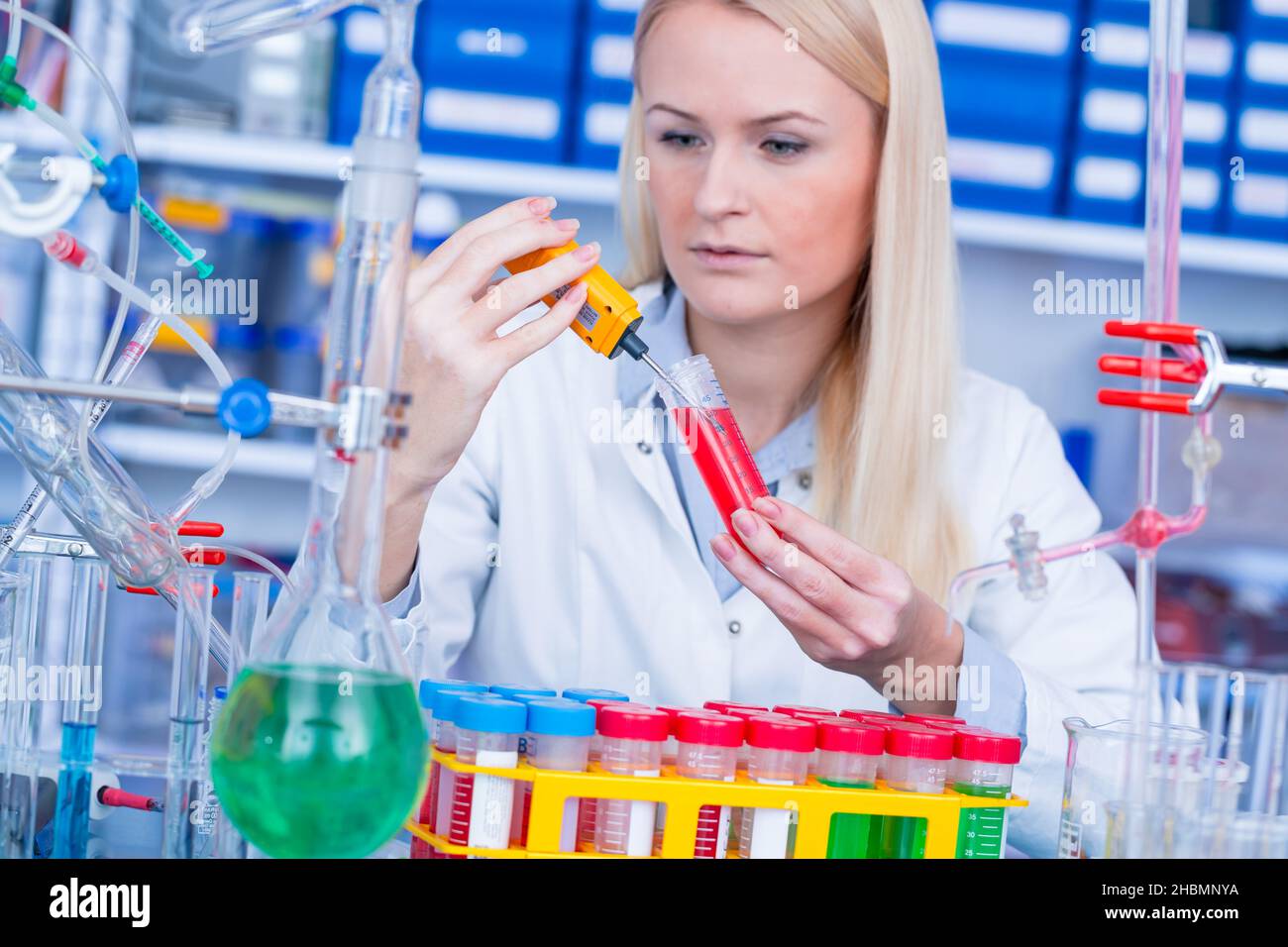 Girl laboratory Assistant works with an antiviral drug in a ...