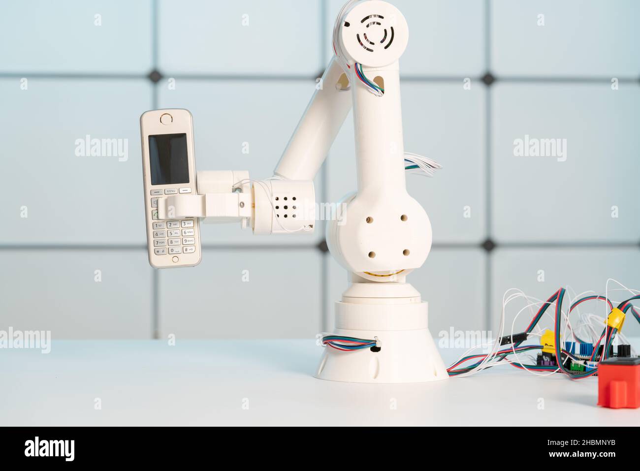Phone in robot arm, bot concept on customer support hotline. Using ...
