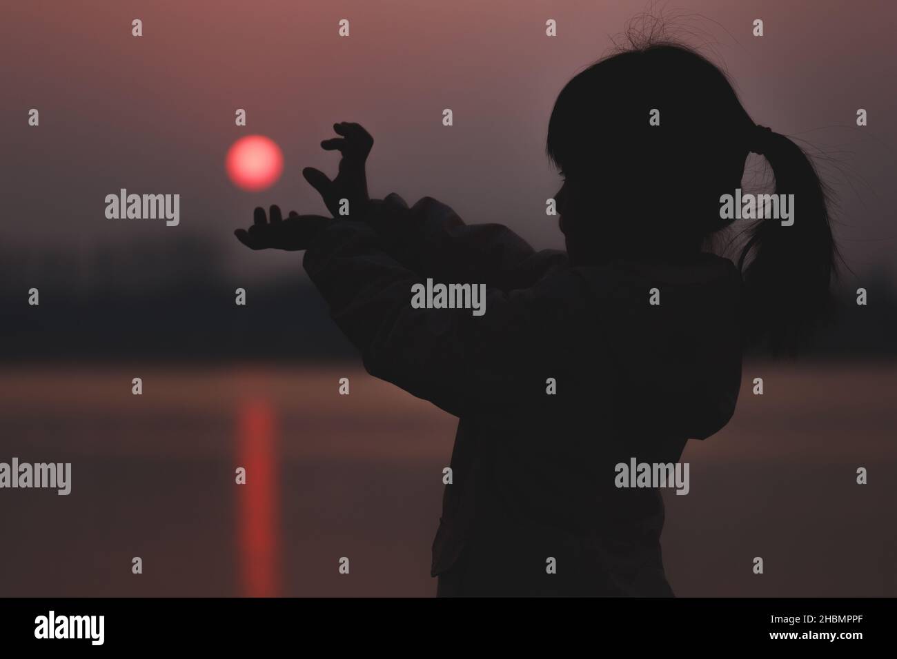 child sunset view and building golden view Stock Photo - Alamy