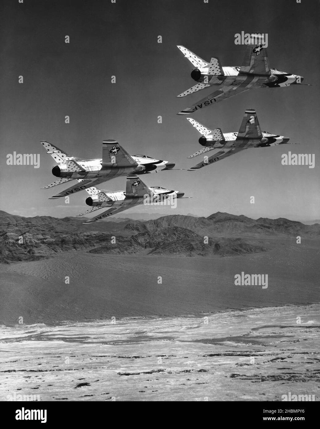 Four US Air Force military jets from the 50s - 60's flying in formation ...
