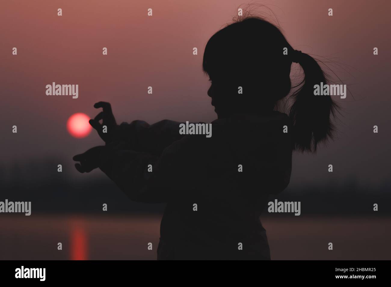 child sunset view and building golden view Stock Photo - Alamy