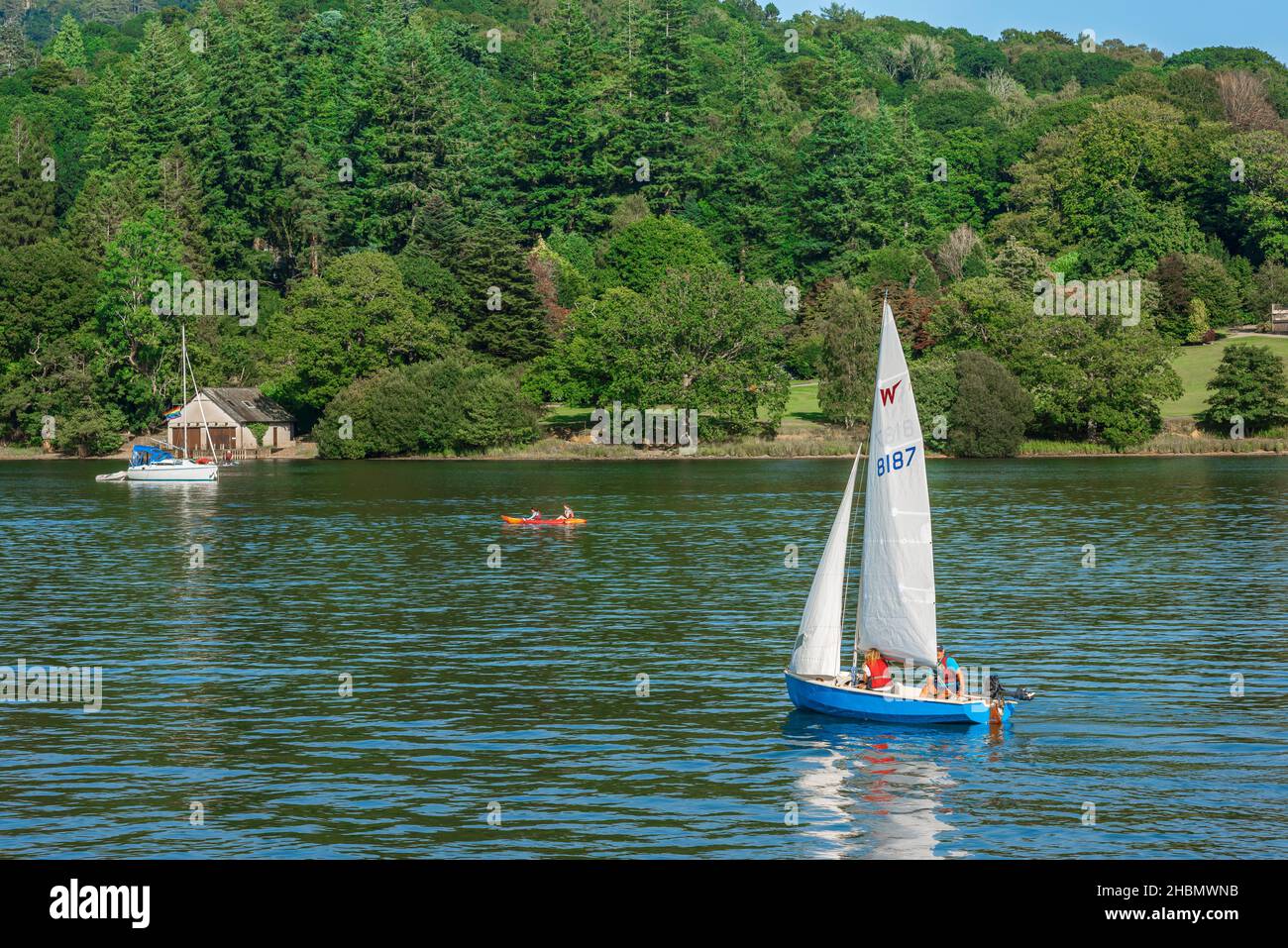 Sailing, view in summer of people in a sail boat cruising on Lake ...