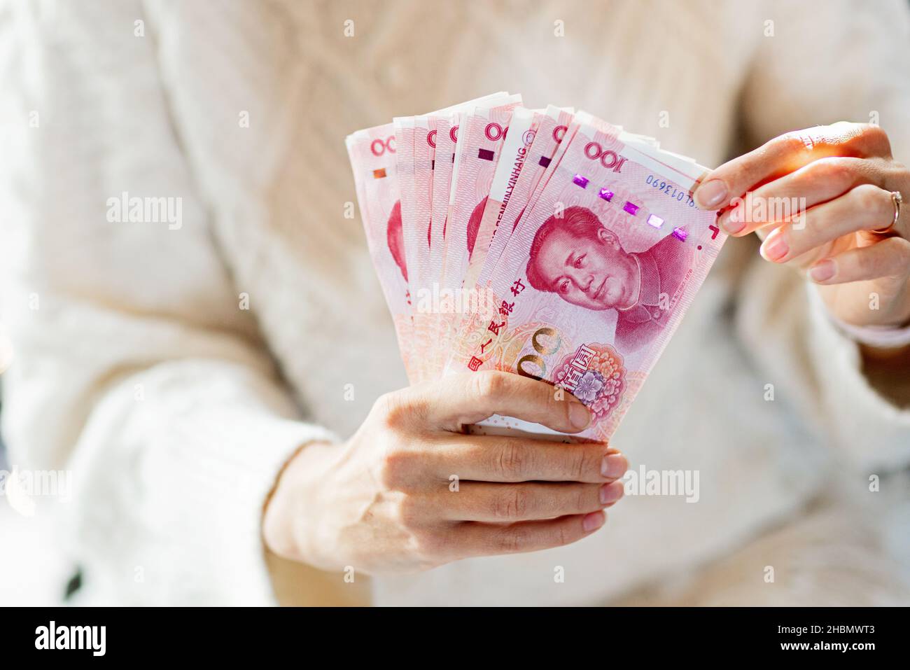 Chinese Lunar New Year celebrations concept. Young asian woman holding ...