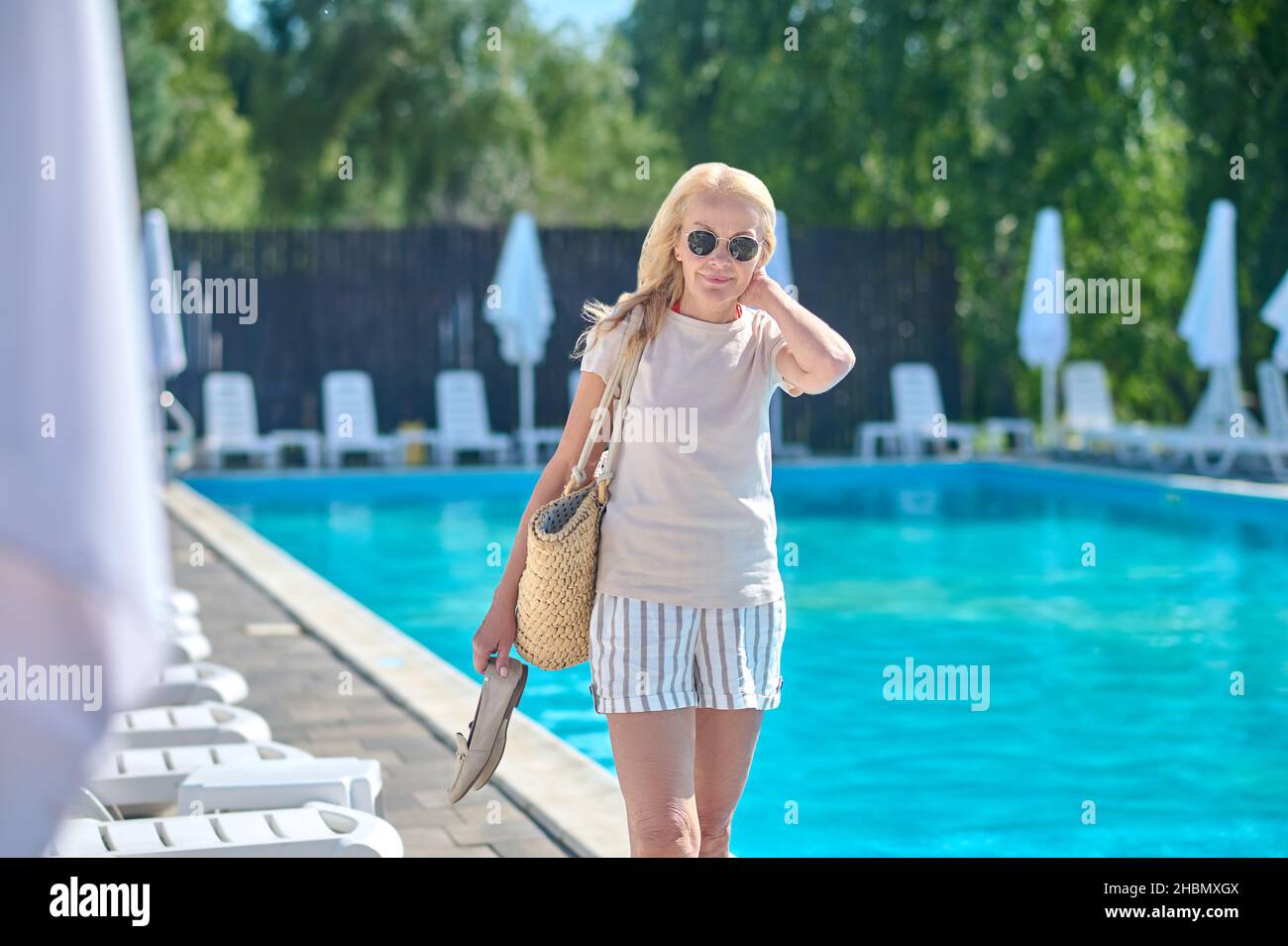 Woman pool swimming walking hi-res stock photography and images - Alamy