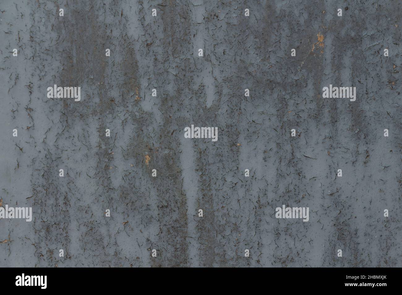 textured metal sheet with peeling gray paint, metal corrosion, rust on ...