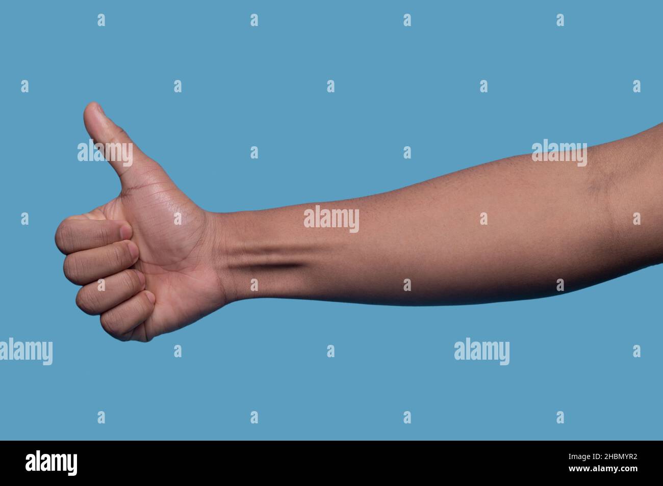 Male hand pointing up using the first digit Stock Photo - Alamy
