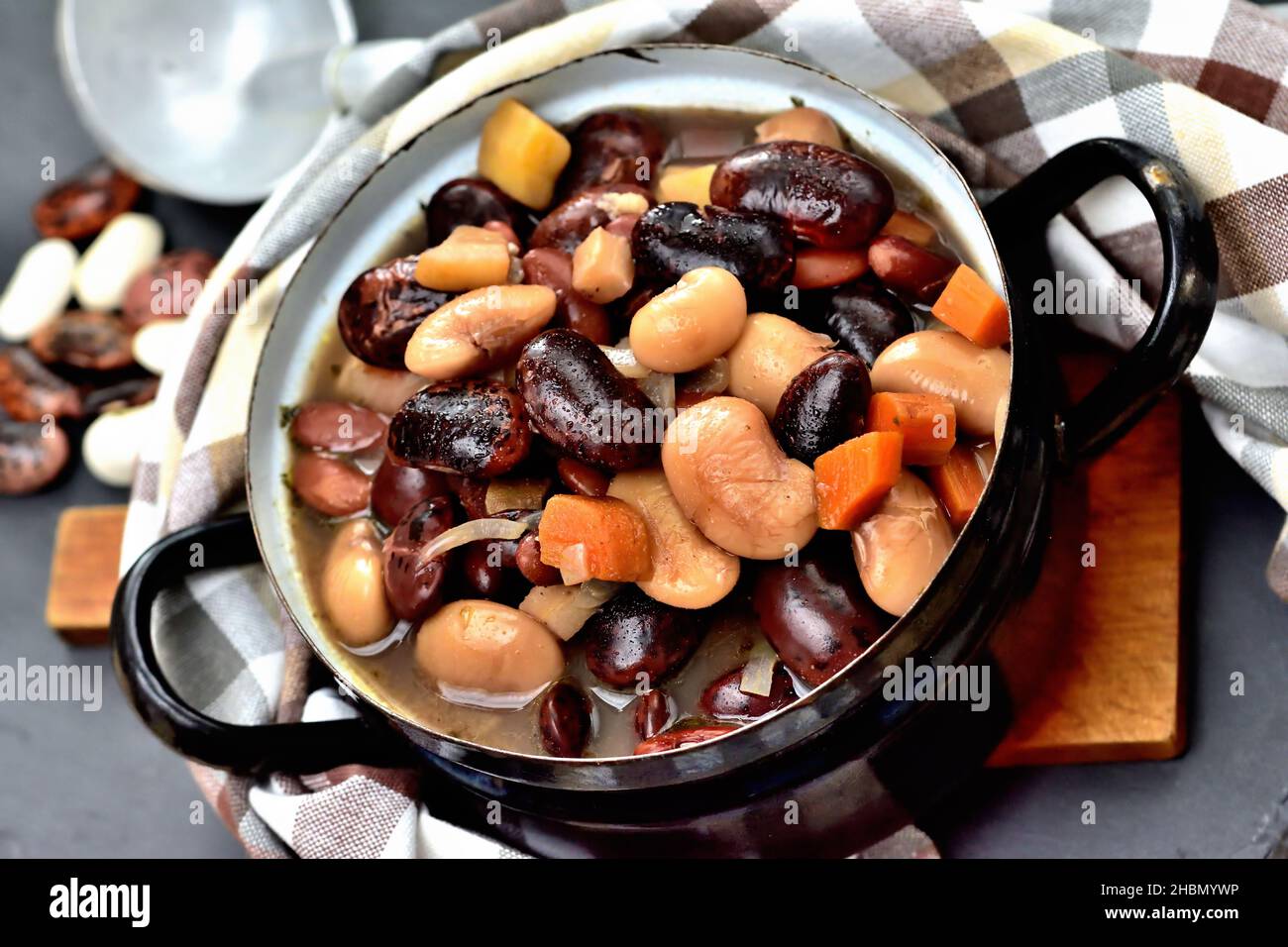 Very thick bean soup with large beans in an old enamel pot Stock Photo ...