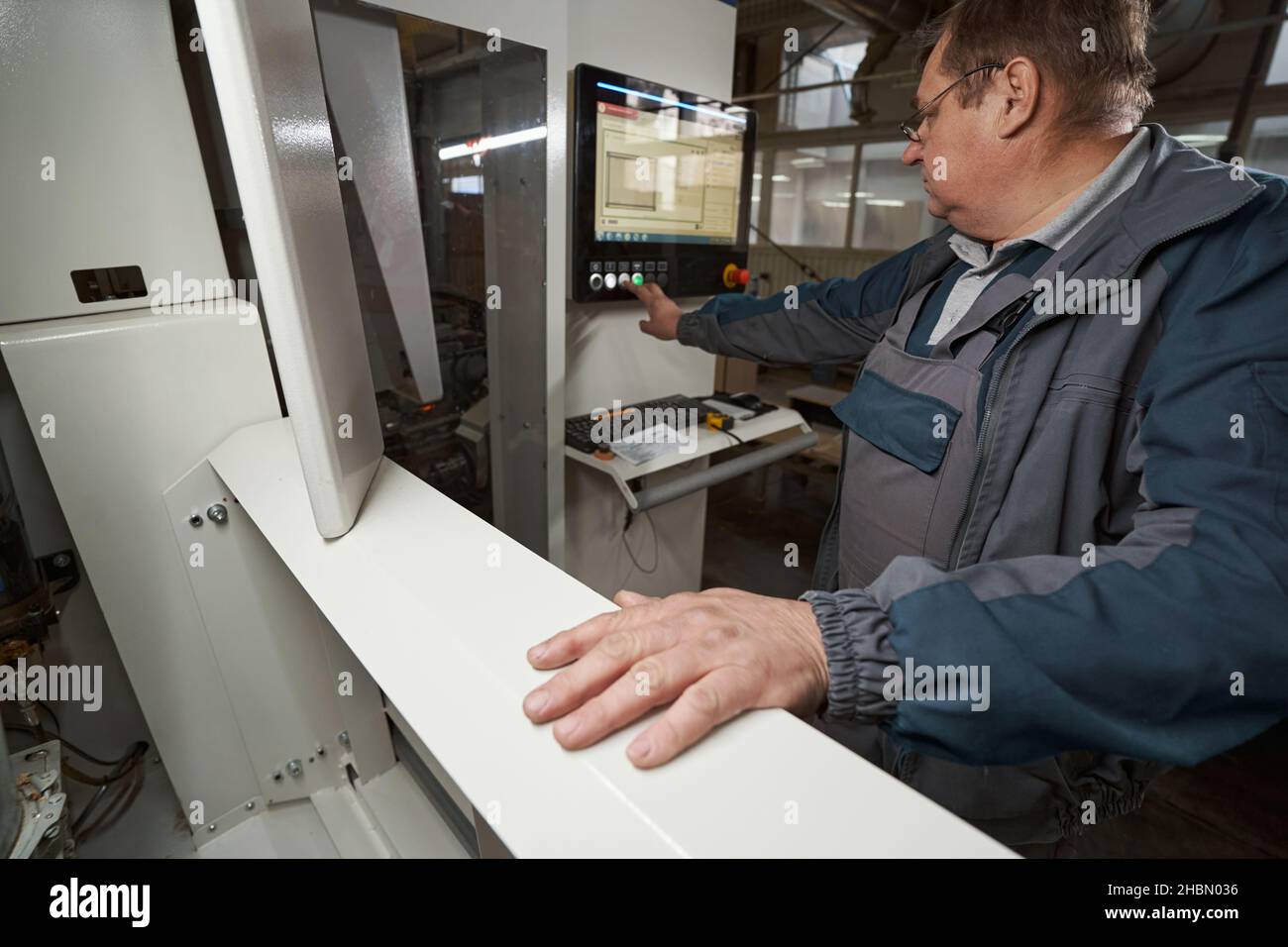 Male carpenter using woodworking electric tool at his work Stock Photo ...