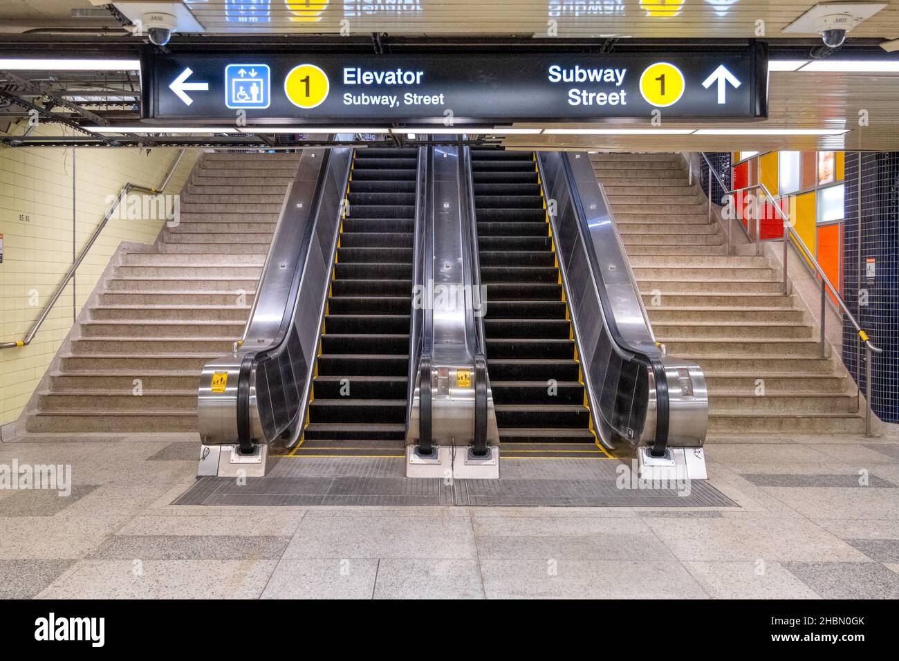 Escalators, stairs, and signs inside of the Wilson Subway Station. Dec ...