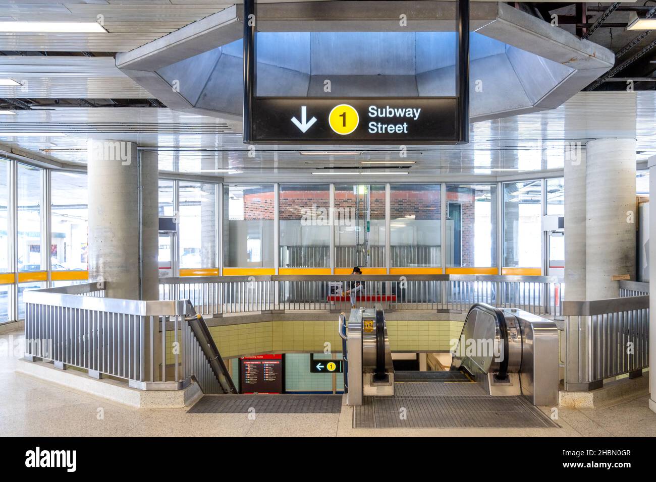 Interior architecture with escalators and signs inside of the Wilson ...