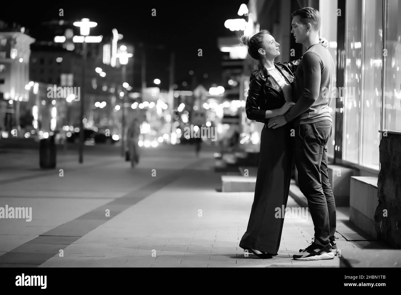 Beautiful couple on a date in a night city outdoor Stock Photo - Alamy