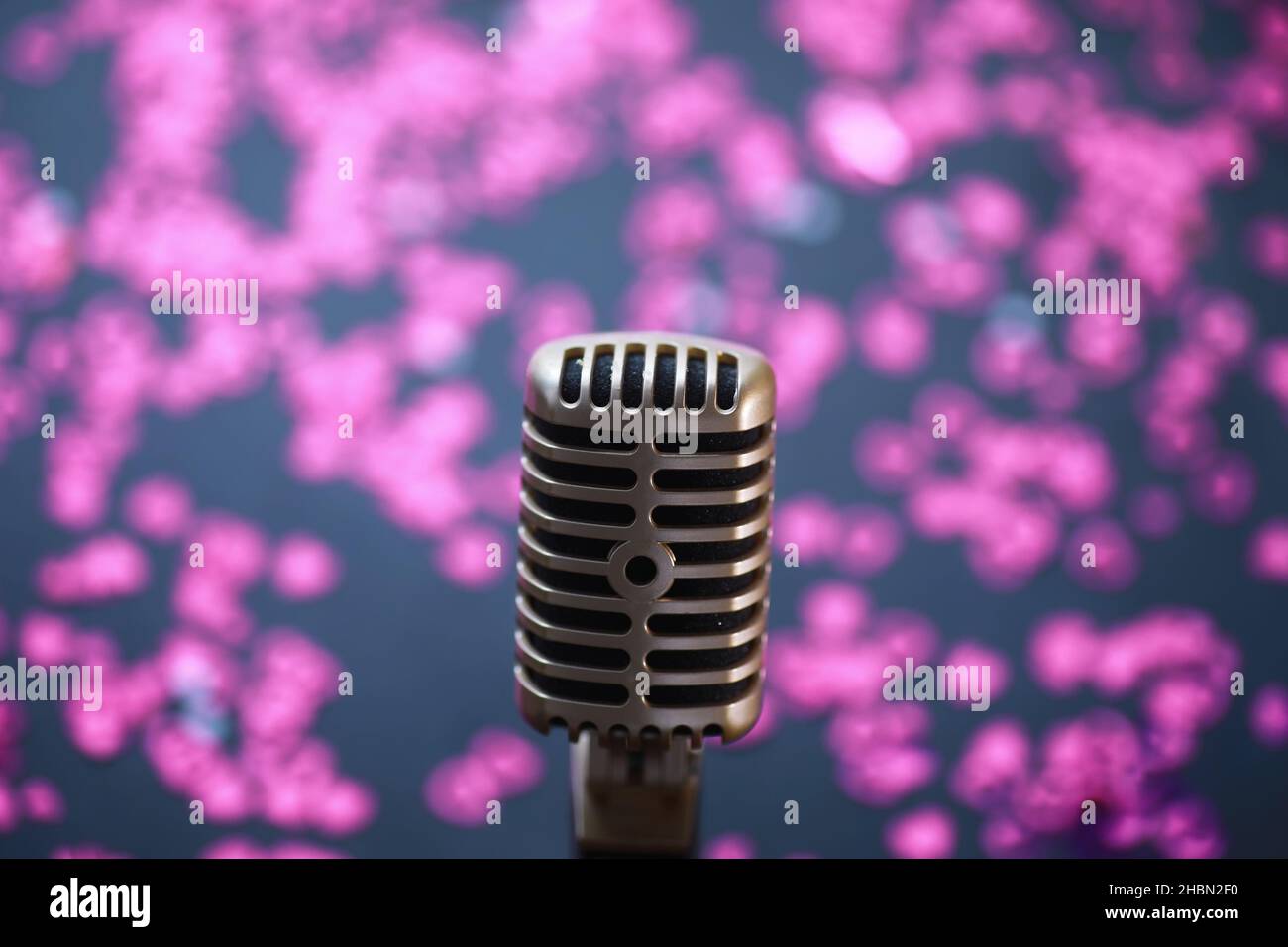 The concept of media presentations. Retro microphone on background ...