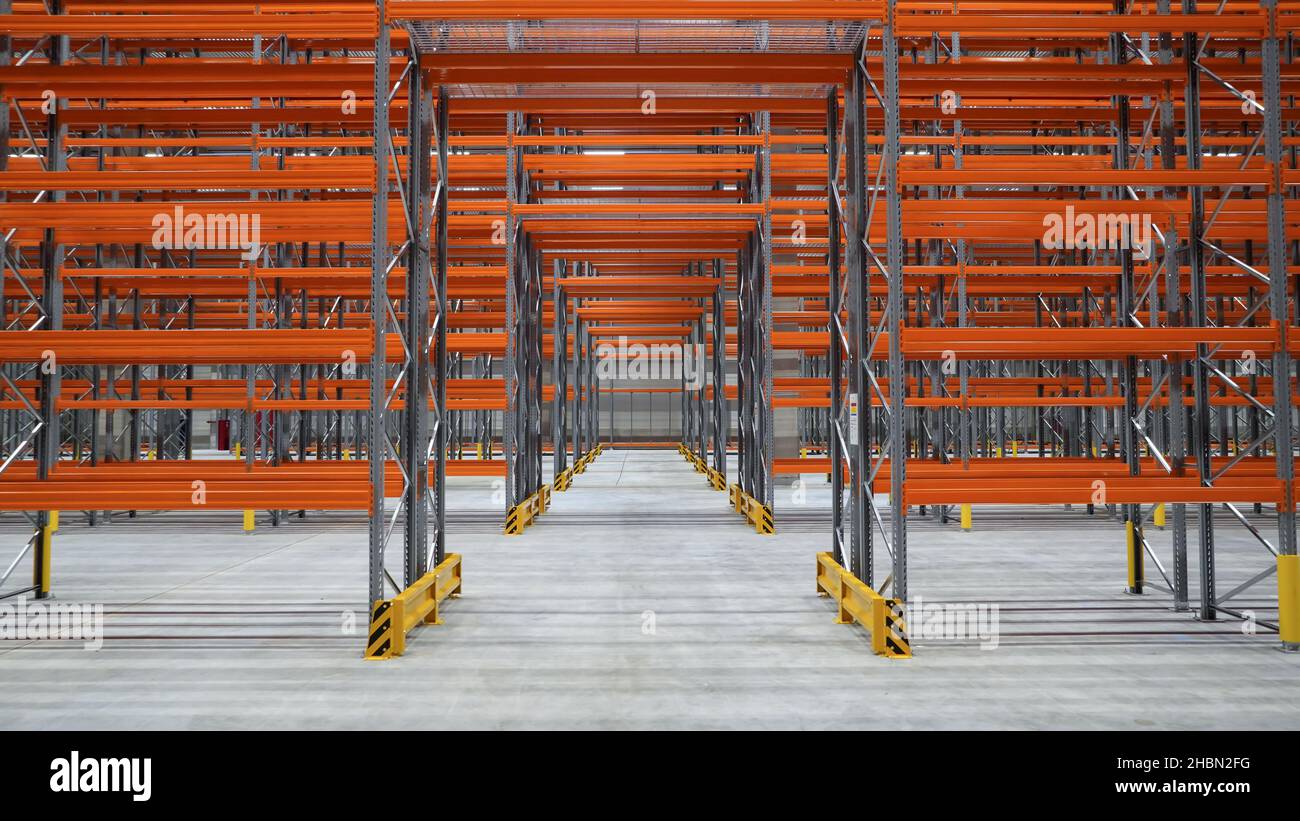 logistics warehouse with empty high racks Stock Photo - Alamy