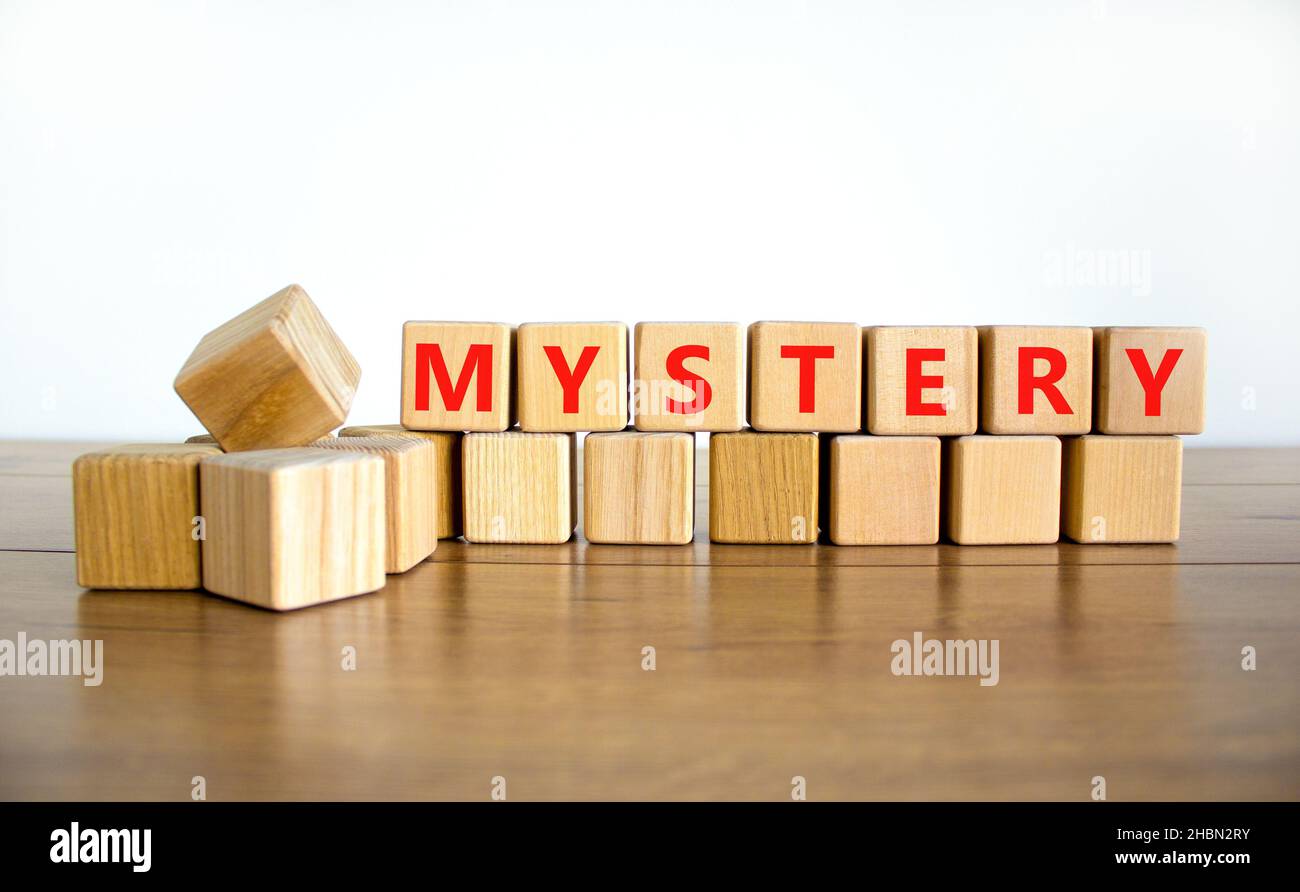 Mystery symbol. The concept word Mystery on wooden cubes. Beautiful ...