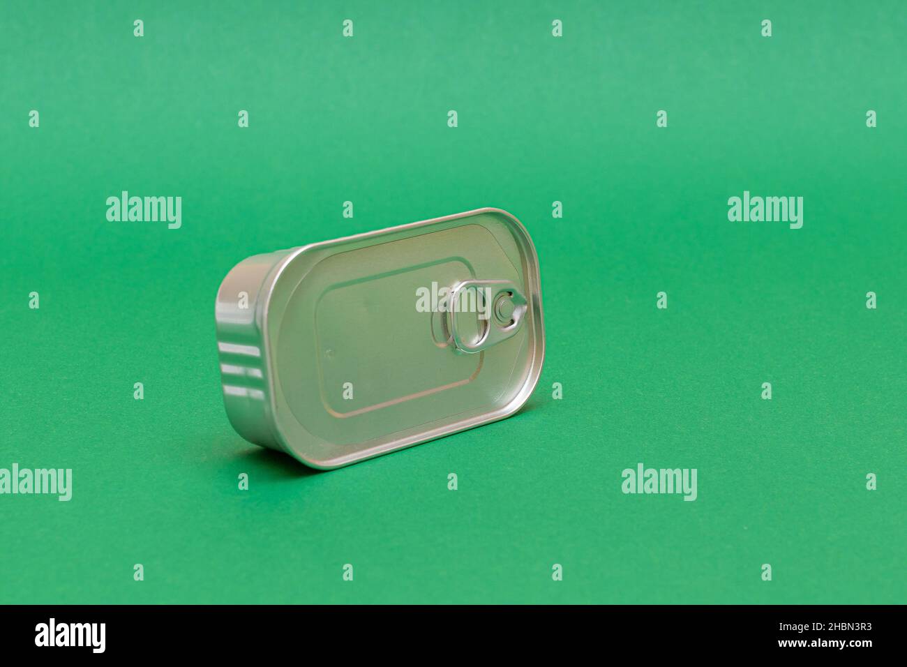 Unopened Tin Can with Blank Edge on Green Background. Canned Food ...