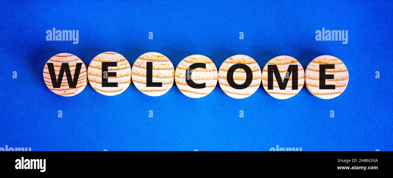Welcome and support symbol. The concept word Welcome on wooden circles ...