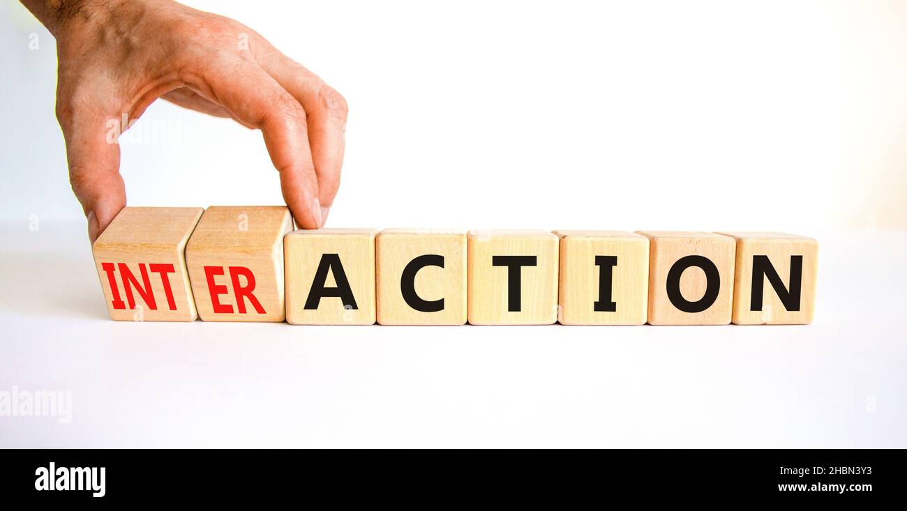 Action or interaction symbol. Businessman turns wooden cubes and ...