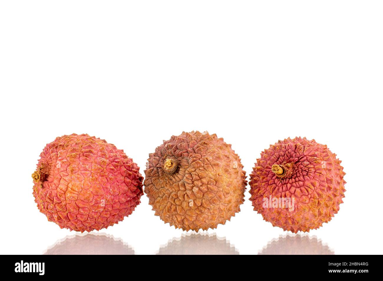 Three ripe organic litchi fruit, close-up, isolated on white Stock ...