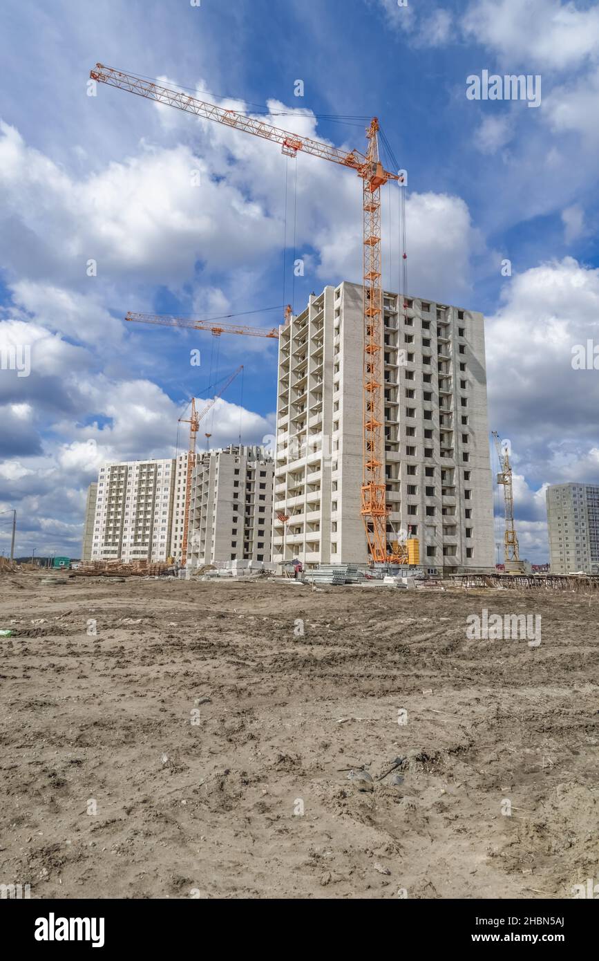 Skyscrapers construction and hoisting cranes Stock Photo - Alamy