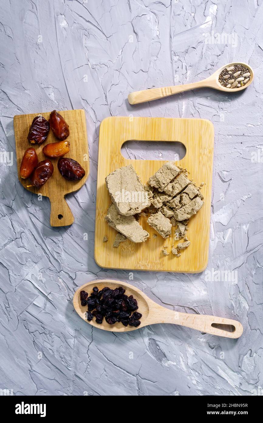 Sunflower halva. Halva pieces grey background. Top view. Vertical photo Stock Photo - Alamy
