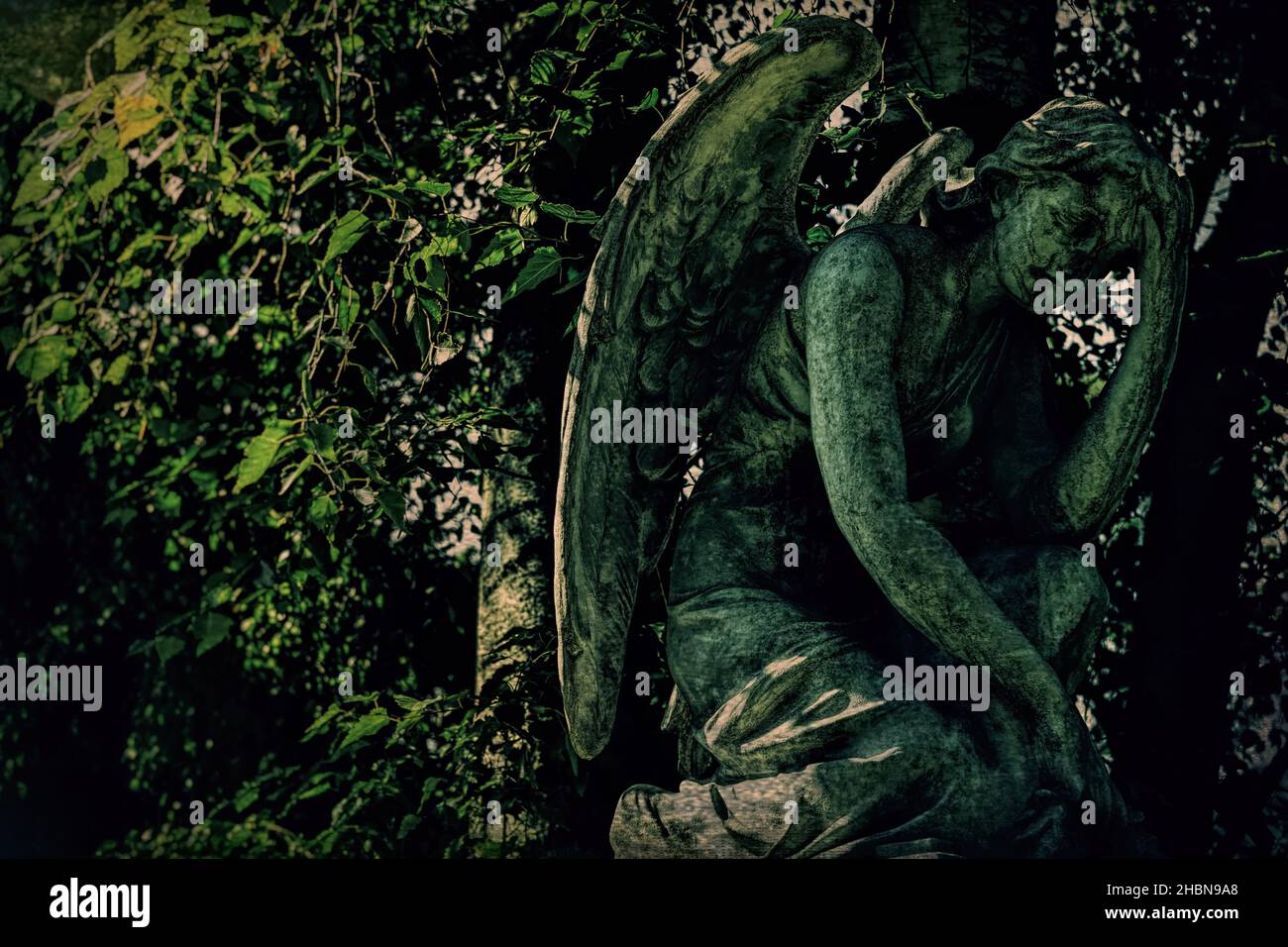 A depressed angel under shady trees Stock Photo - Alamy