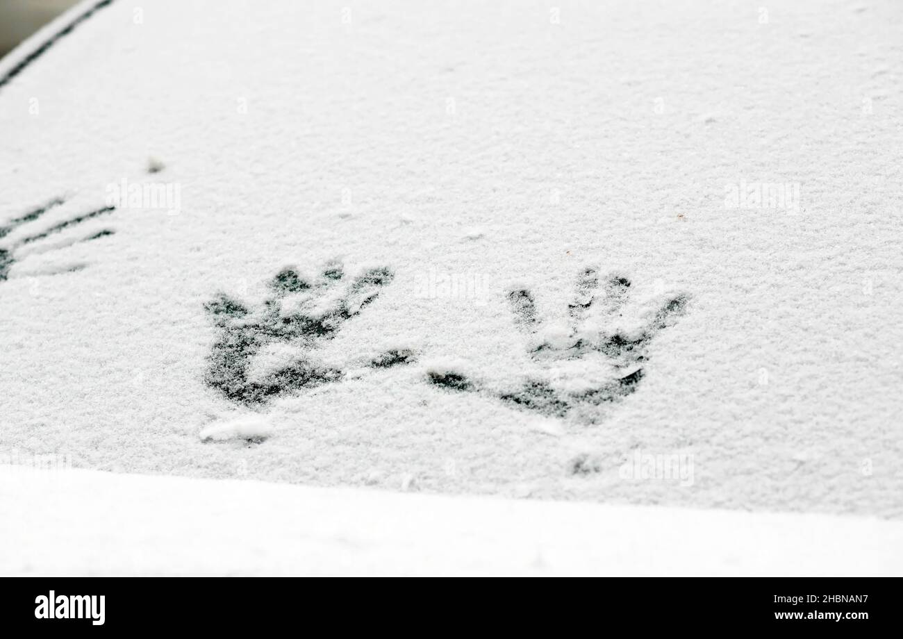 Winter, handprints on a snow windshield car Stock Photo - Alamy