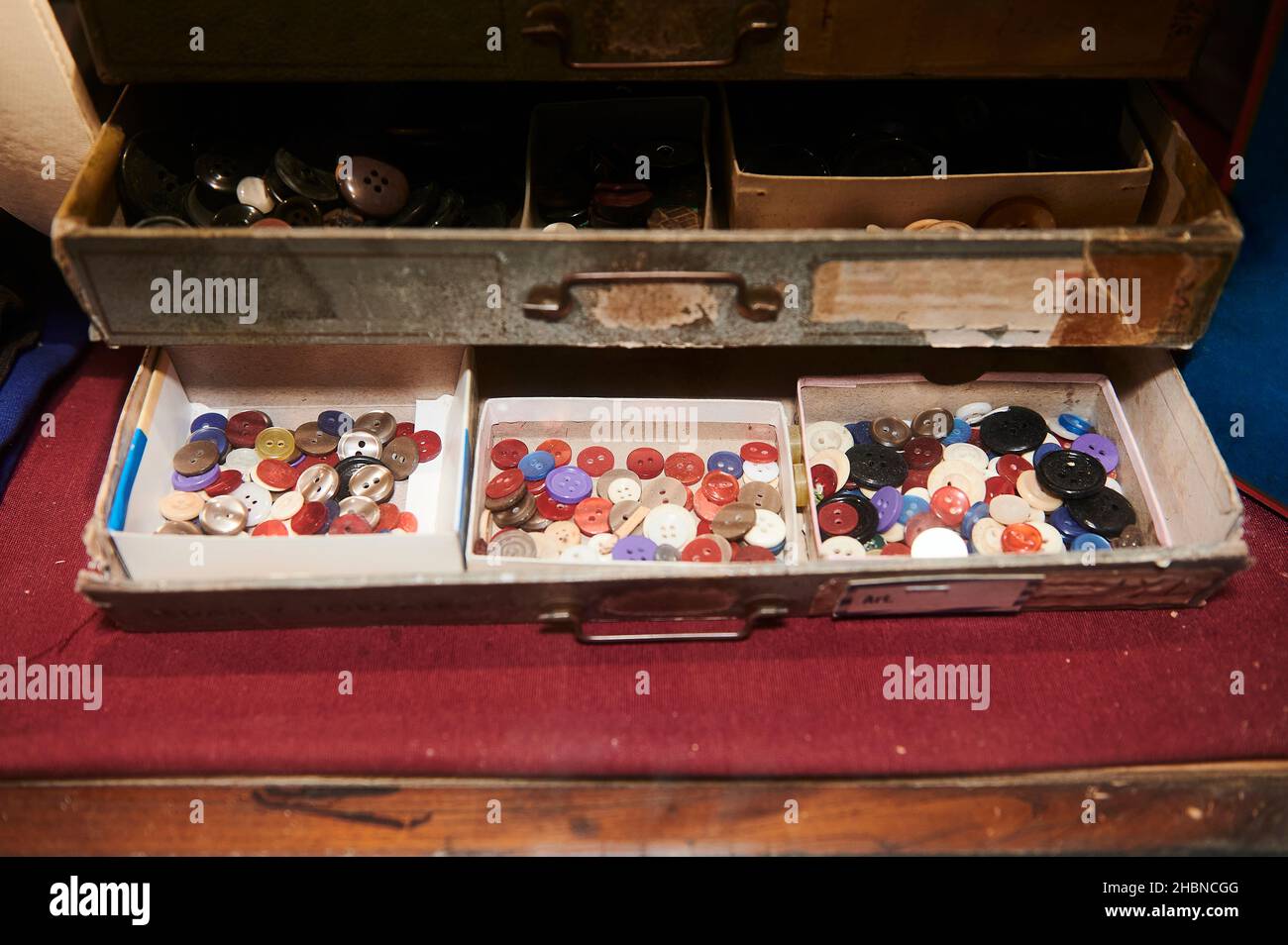 Old box with ancient buttons of different sizes and colors for sewing ...