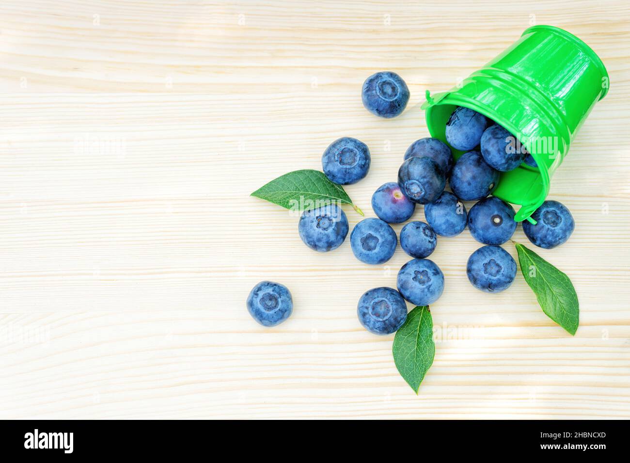 Blueberries spill out metal hi-res stock photography and images - Alamy