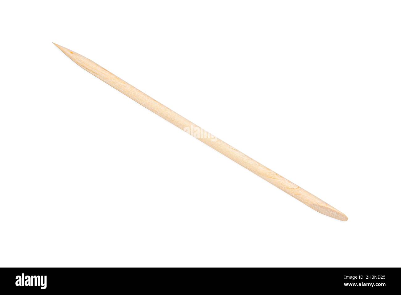 Close-up of an orange wood stick used for manicure and pedicure ...