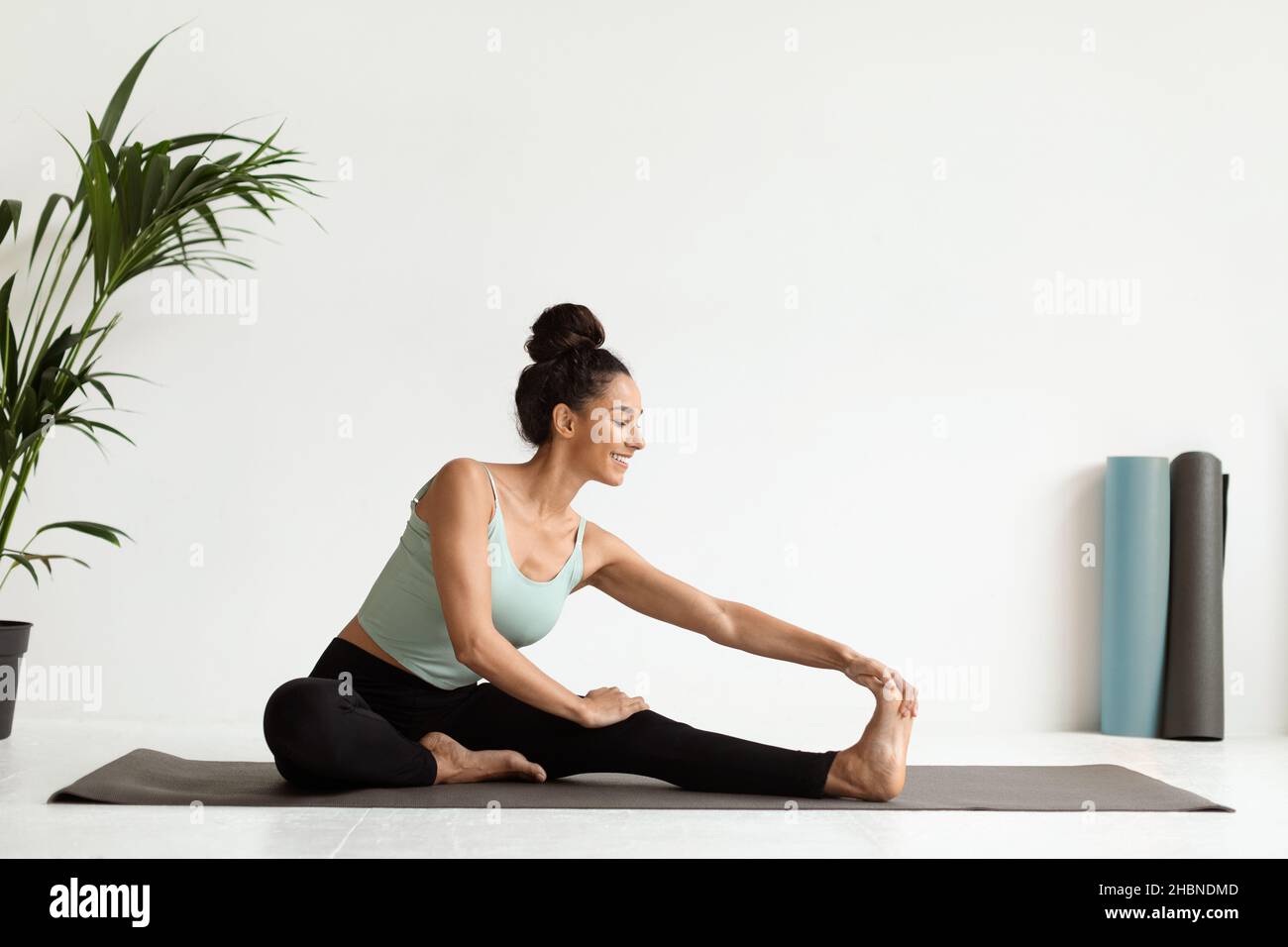 Woman sitting legs gymnastics hi-res stock photography and images - Alamy