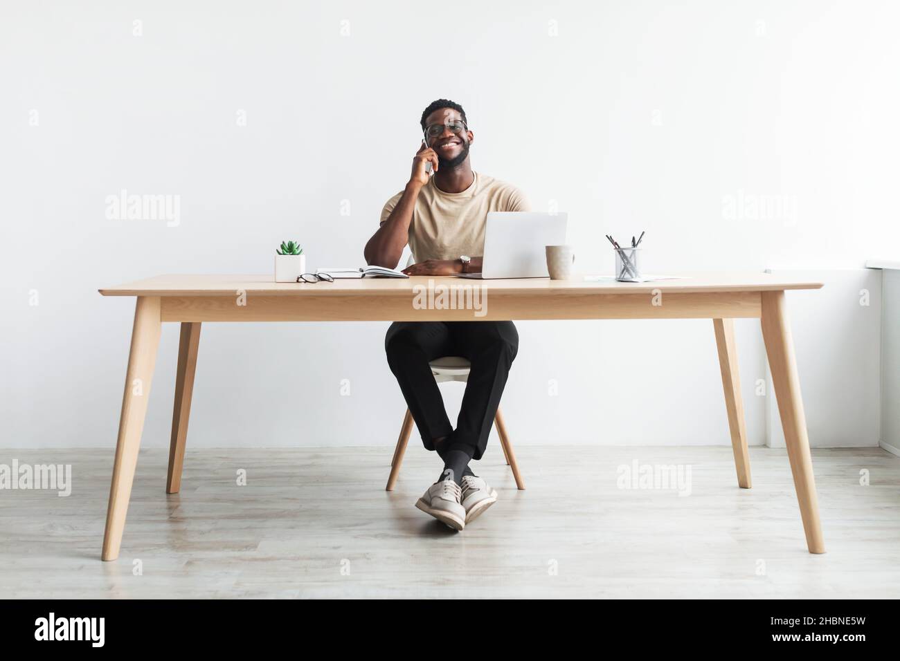 Happy black businessman talking on smartphone, having phone ...