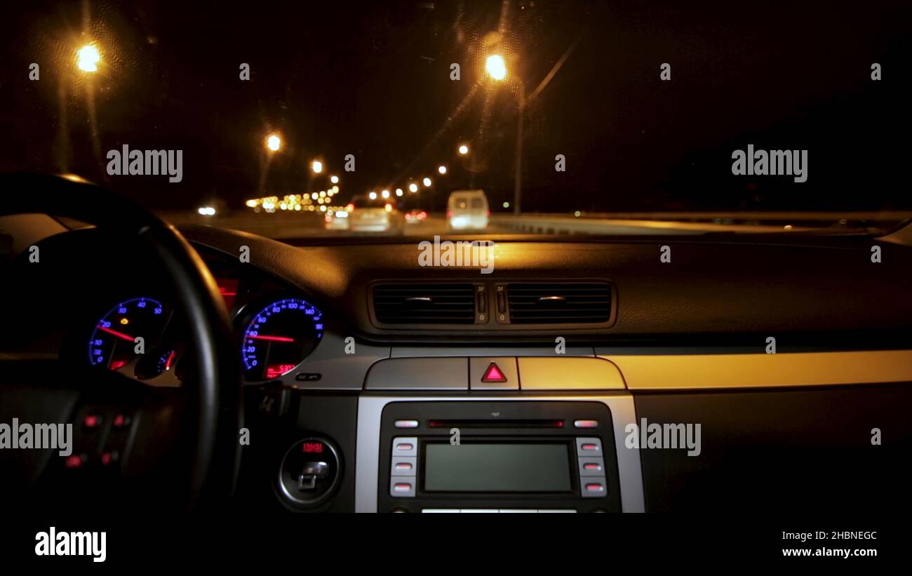Car driving at night. Driving car in the city view from the interior ...