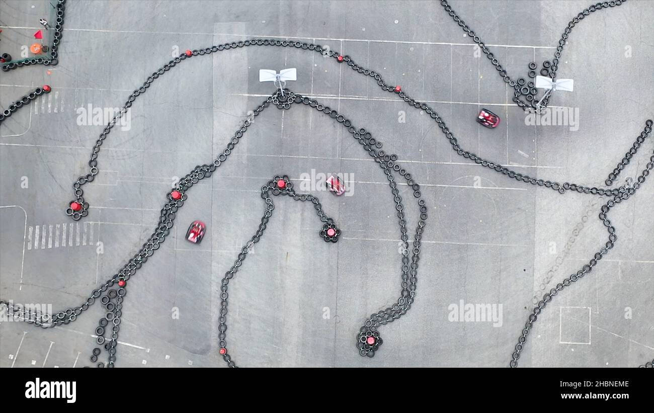 Aerial view of the karting track with moving small red karts, race and ...