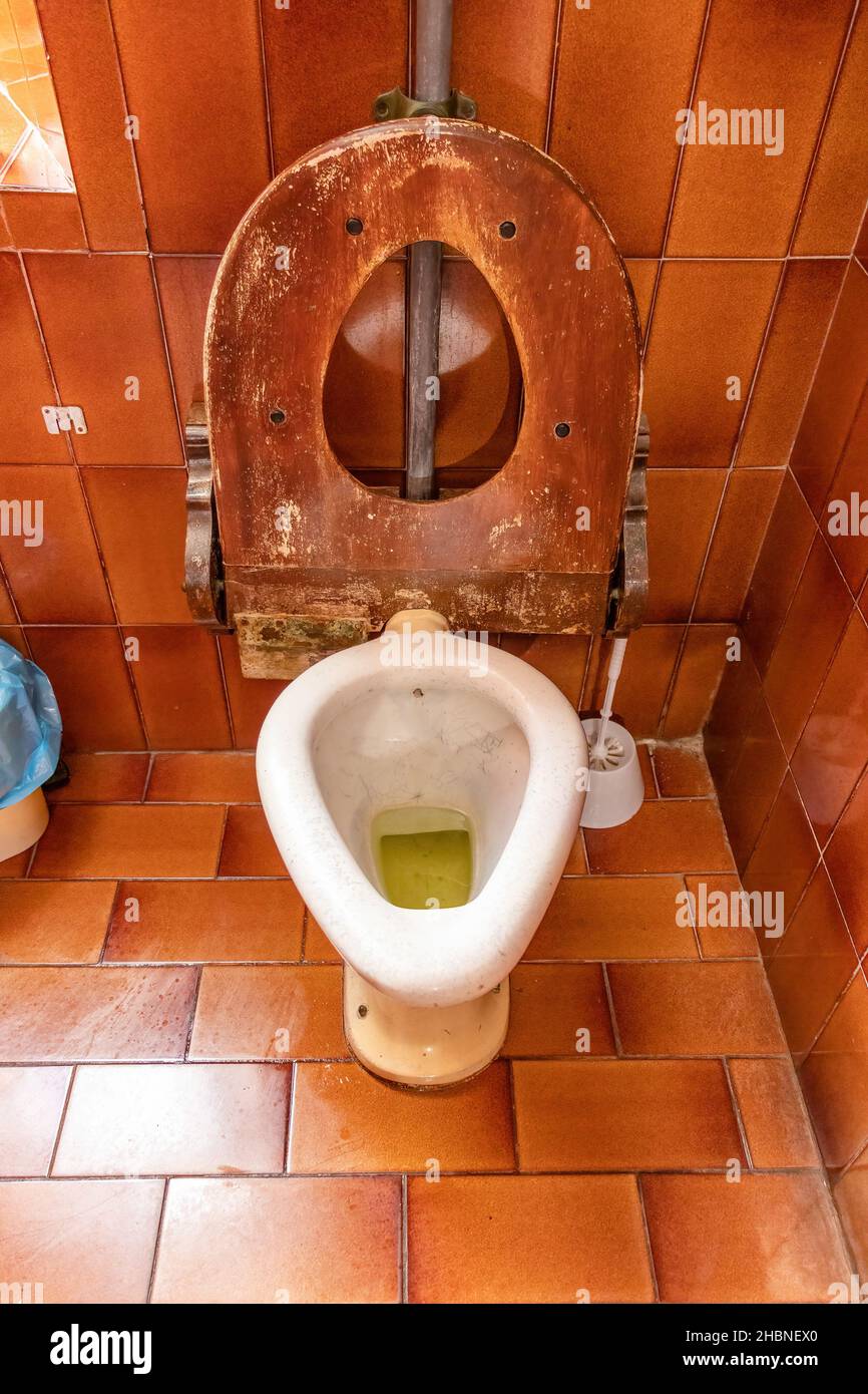 Old toilet with wooden lid Stock Photo - Alamy