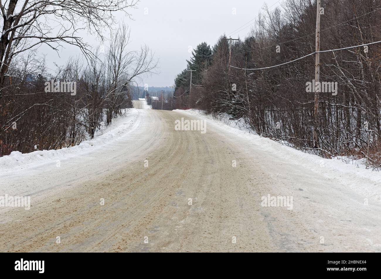 Snow covered road lined trees hi-res stock photography and images - Alamy