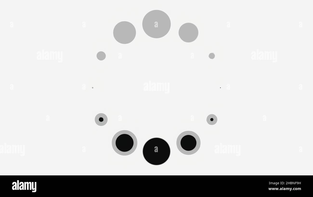 Abstract black and grey spinning bubbles in a rotating loading wheel on ...