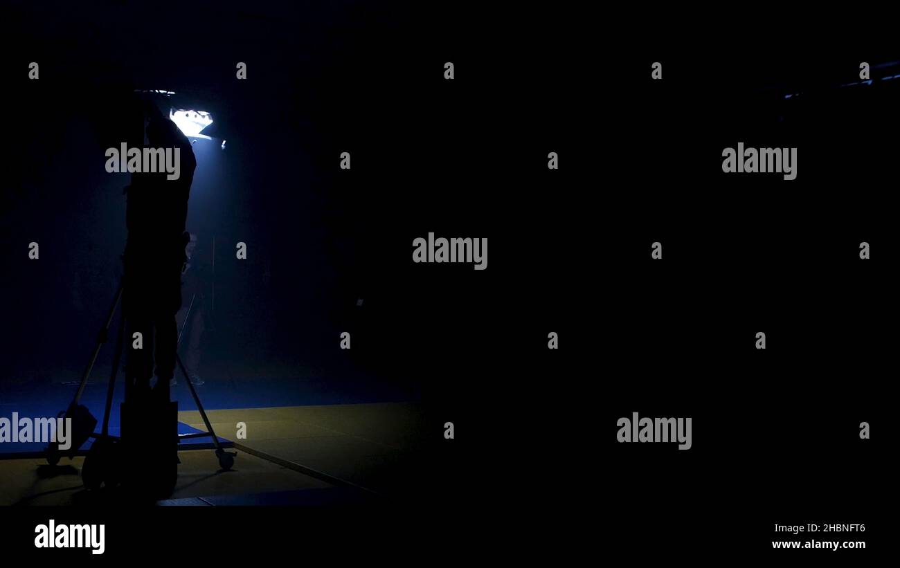 The film crew works on creation of a videoclip. Gaffer prepares ...